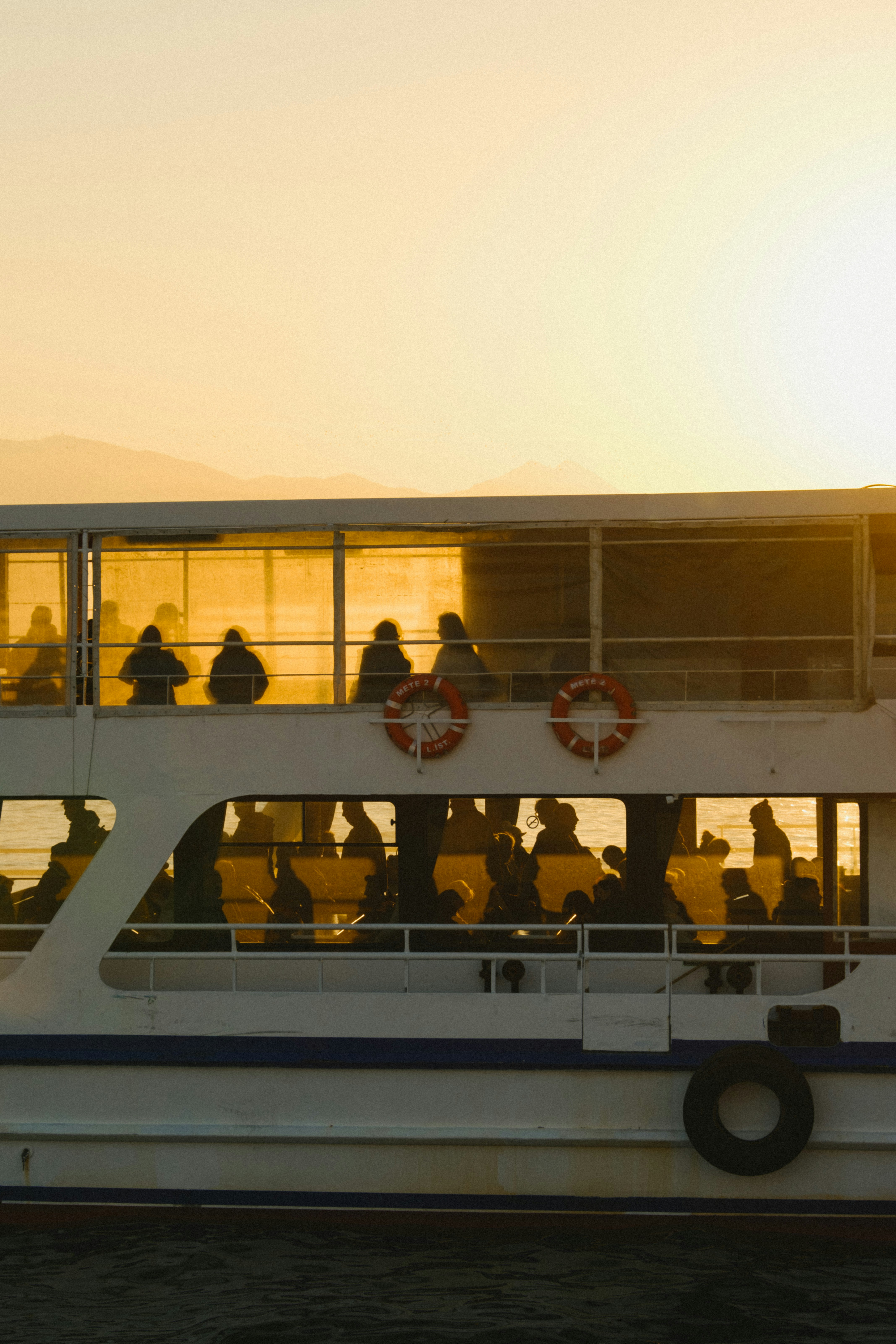 Golden Hour on the Deck: silhouettes and lifebuoys