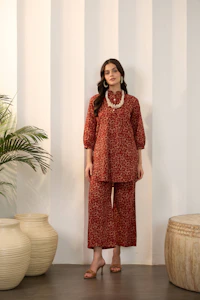 Red Velvet Echo: A poised silhouette in patterned attire