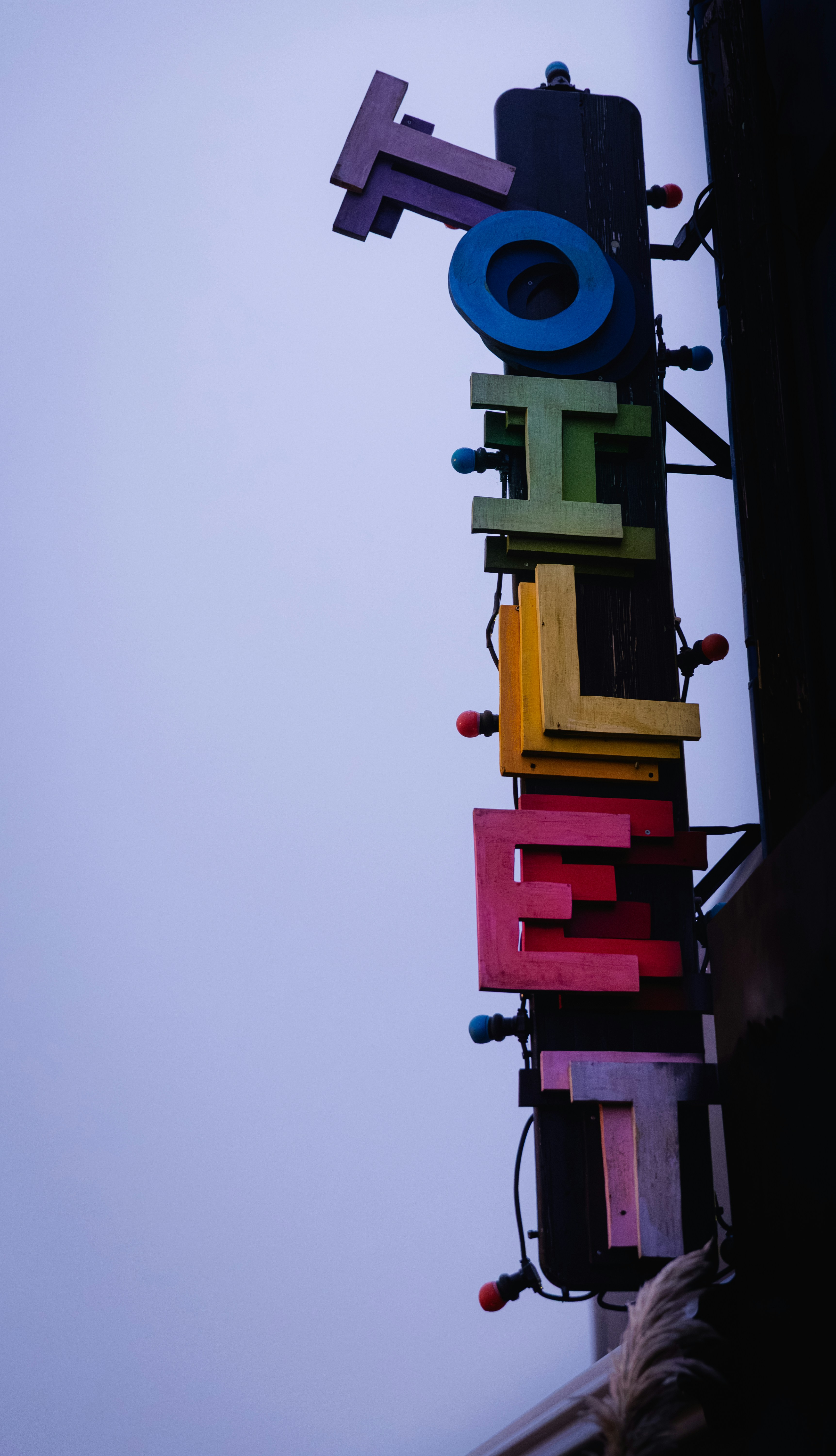 Vertical Signage: A Kaleidoscope of Color in Neon Letters