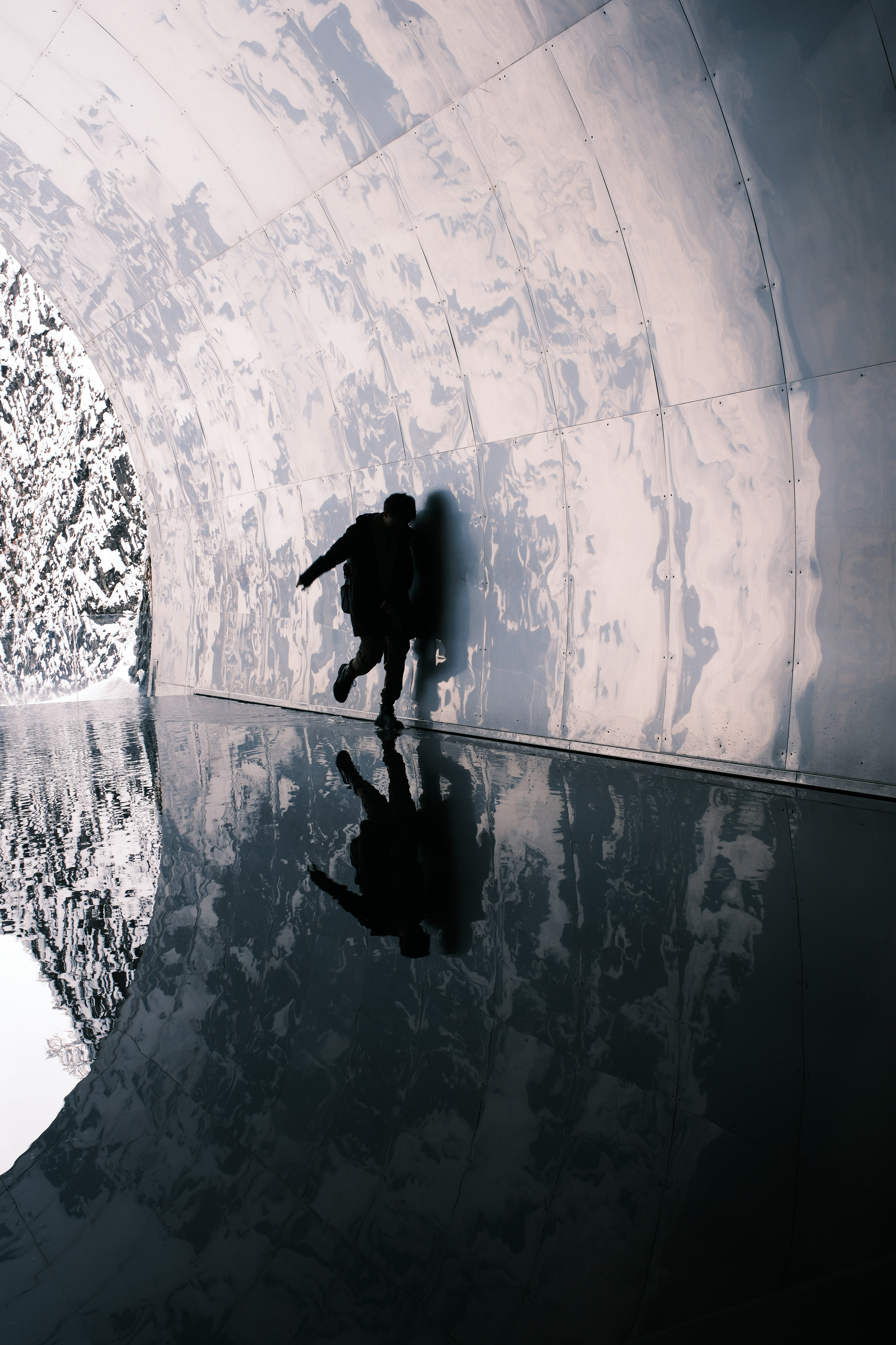 Shadowed Traveler in the Circular Archway