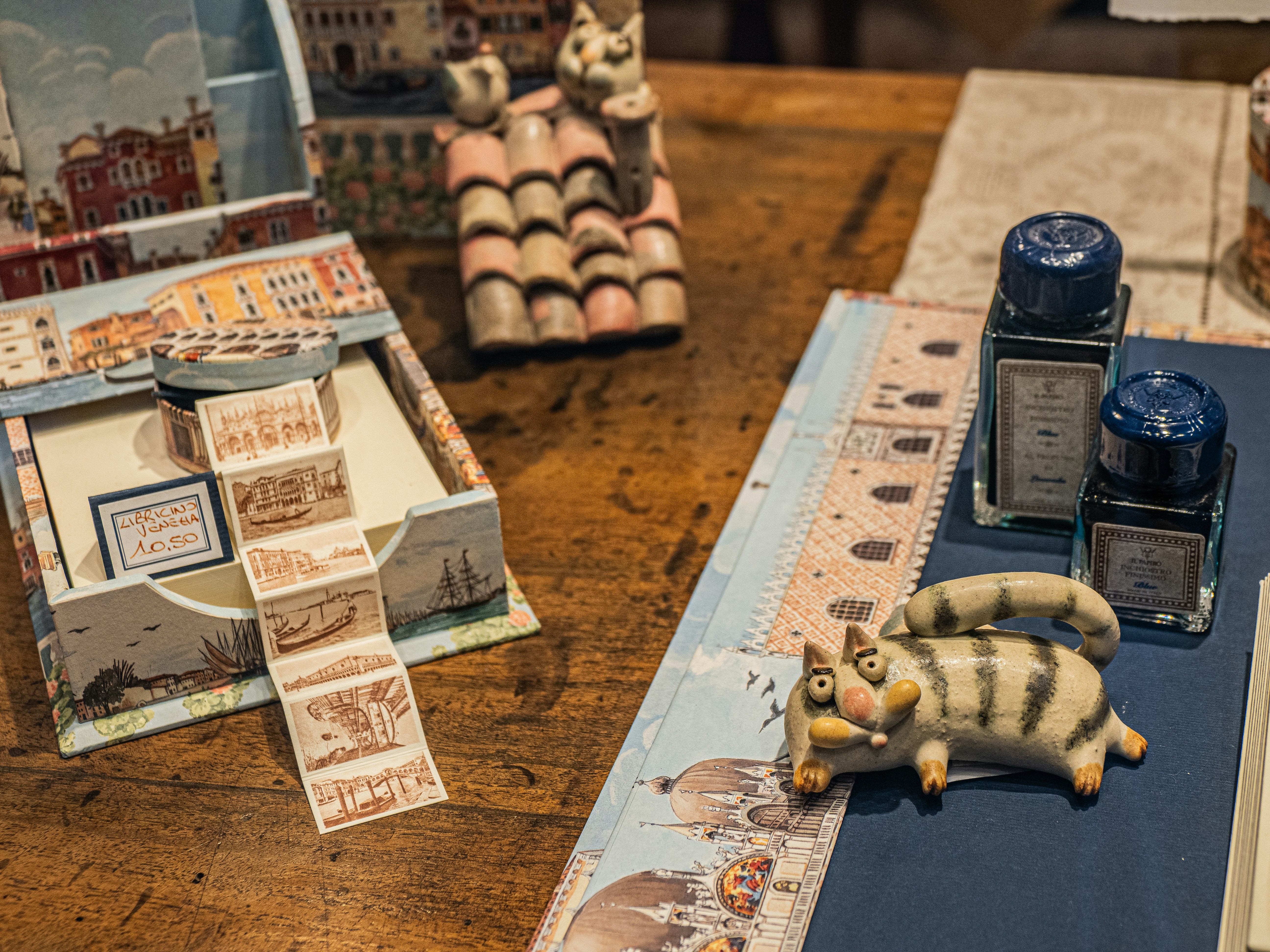 Ink and Miniature Treasures on a Wooden Desk