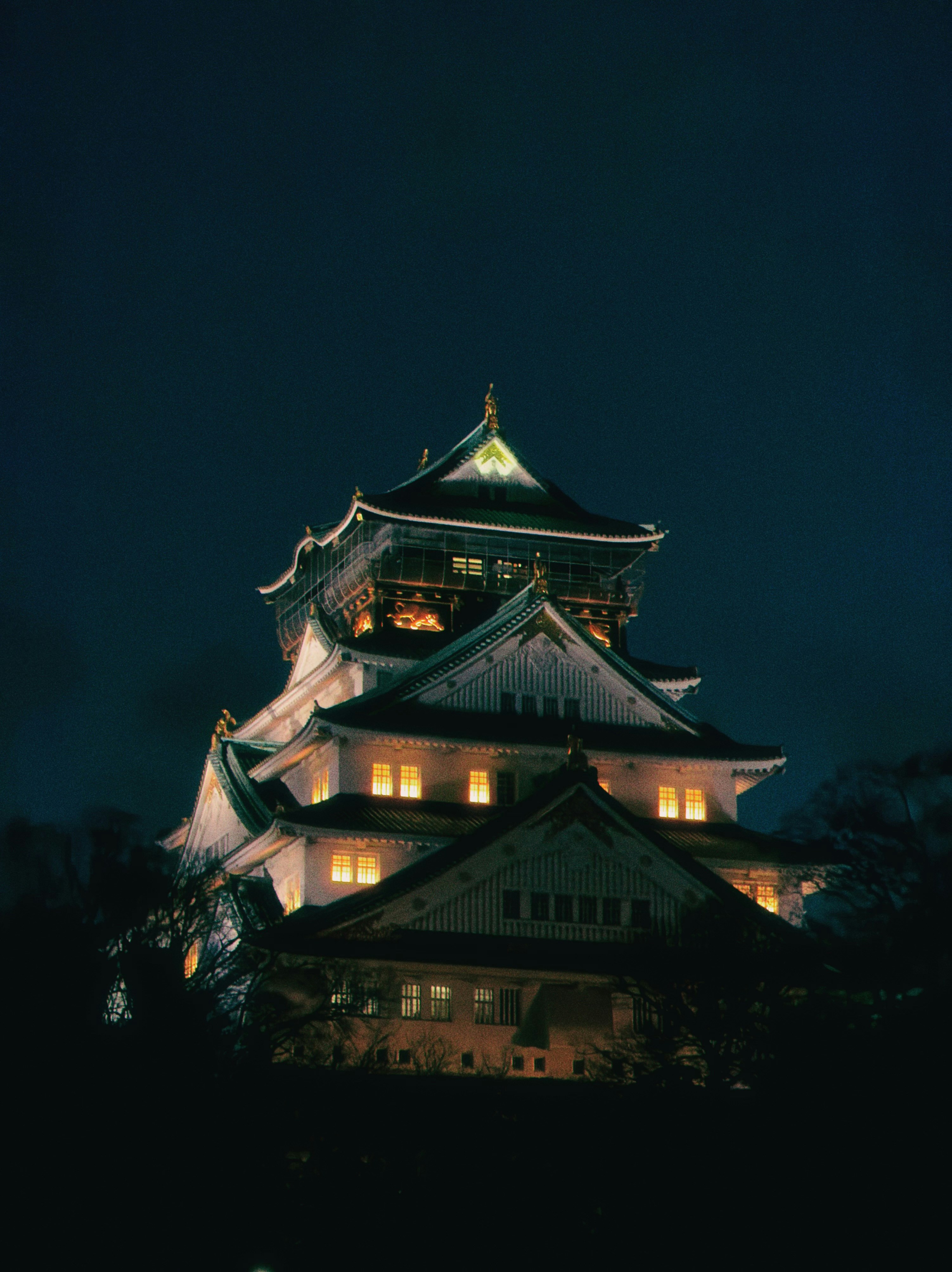 Moonlit Pagoda: A Glowing Nightwatch Over Japanese Castle Rooflines