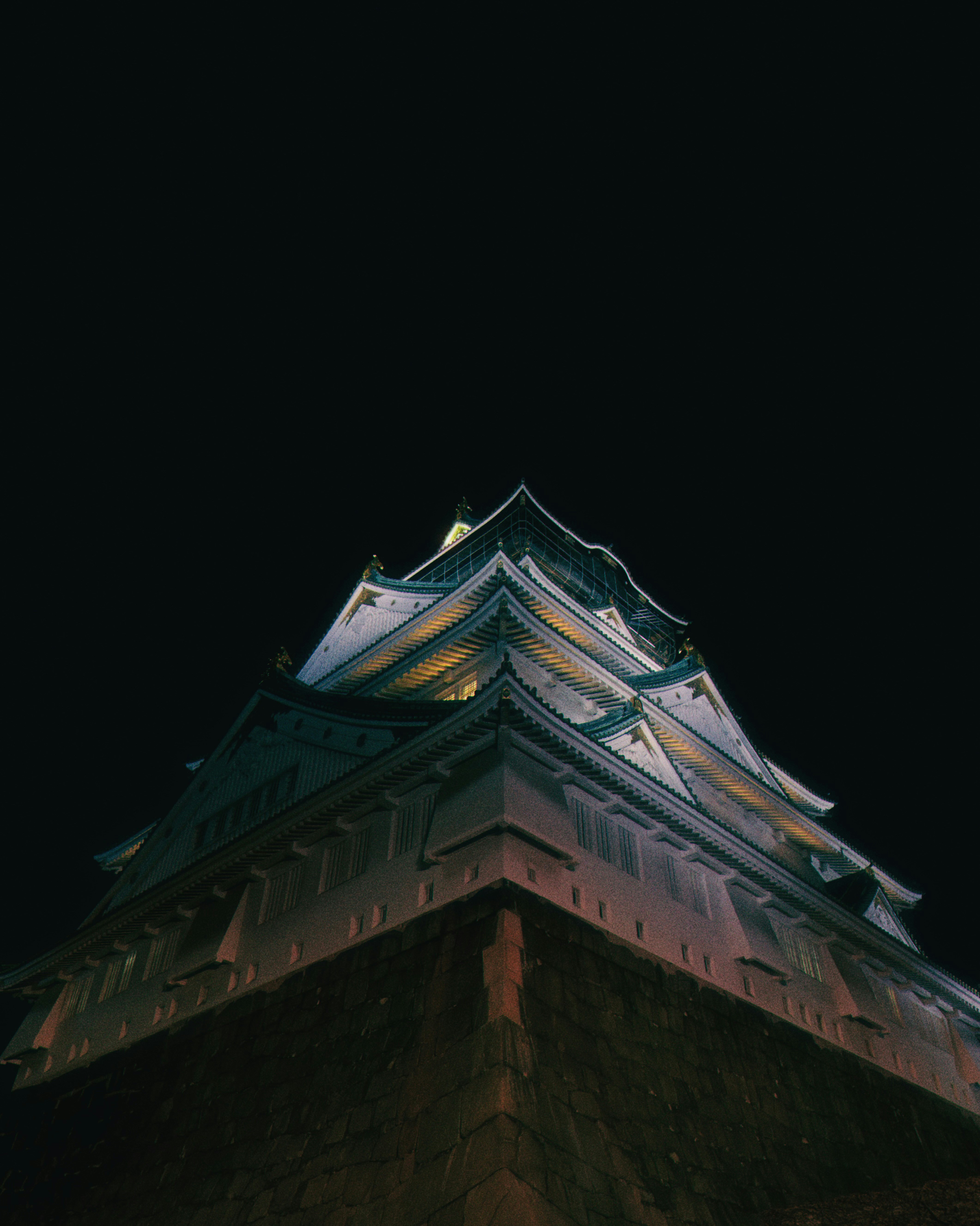 Towering Nightfall: A Japanese Castle Reaching Midnight