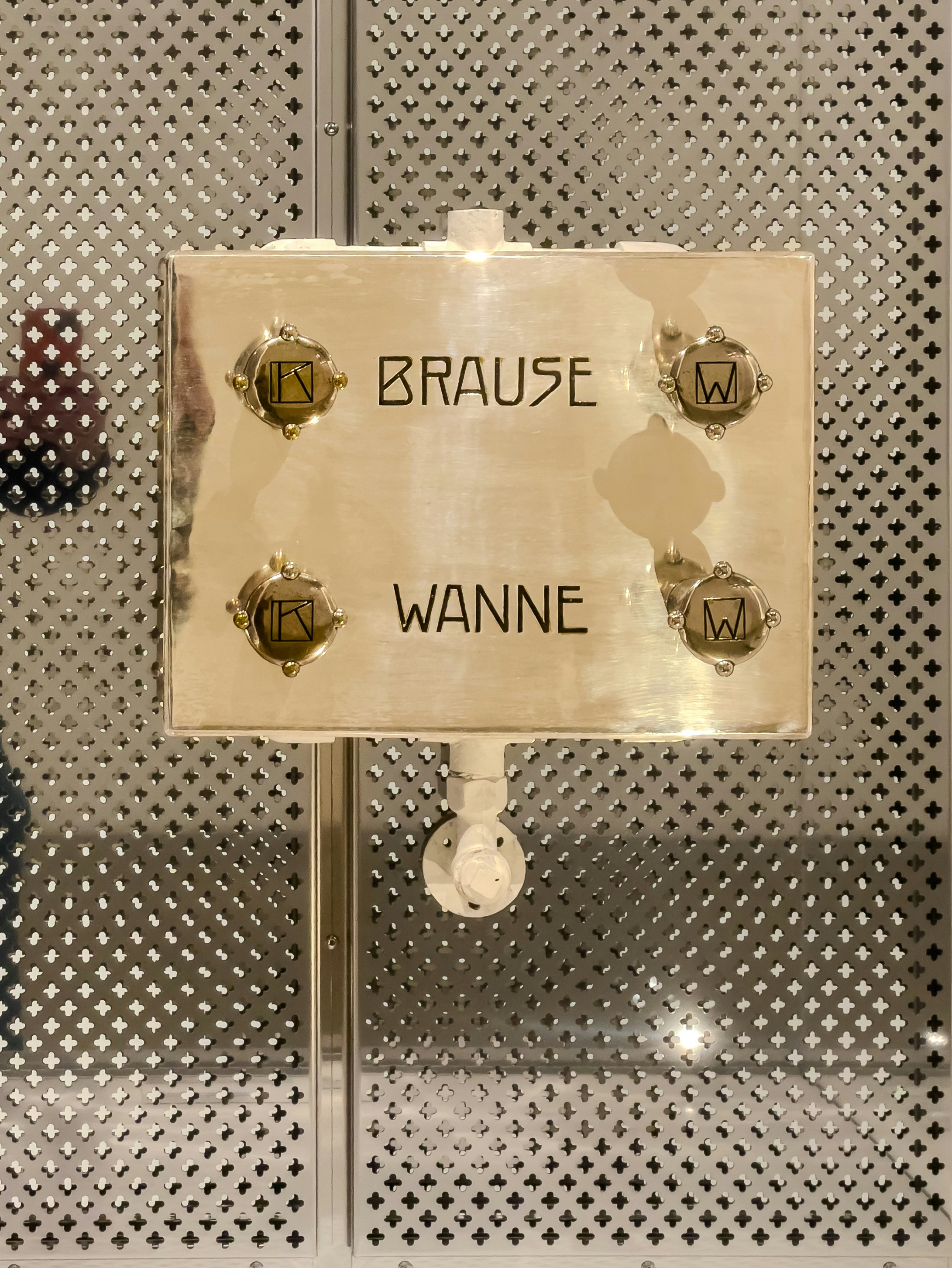 Industrial Brass Panel with Wires and Perforated Metal Background