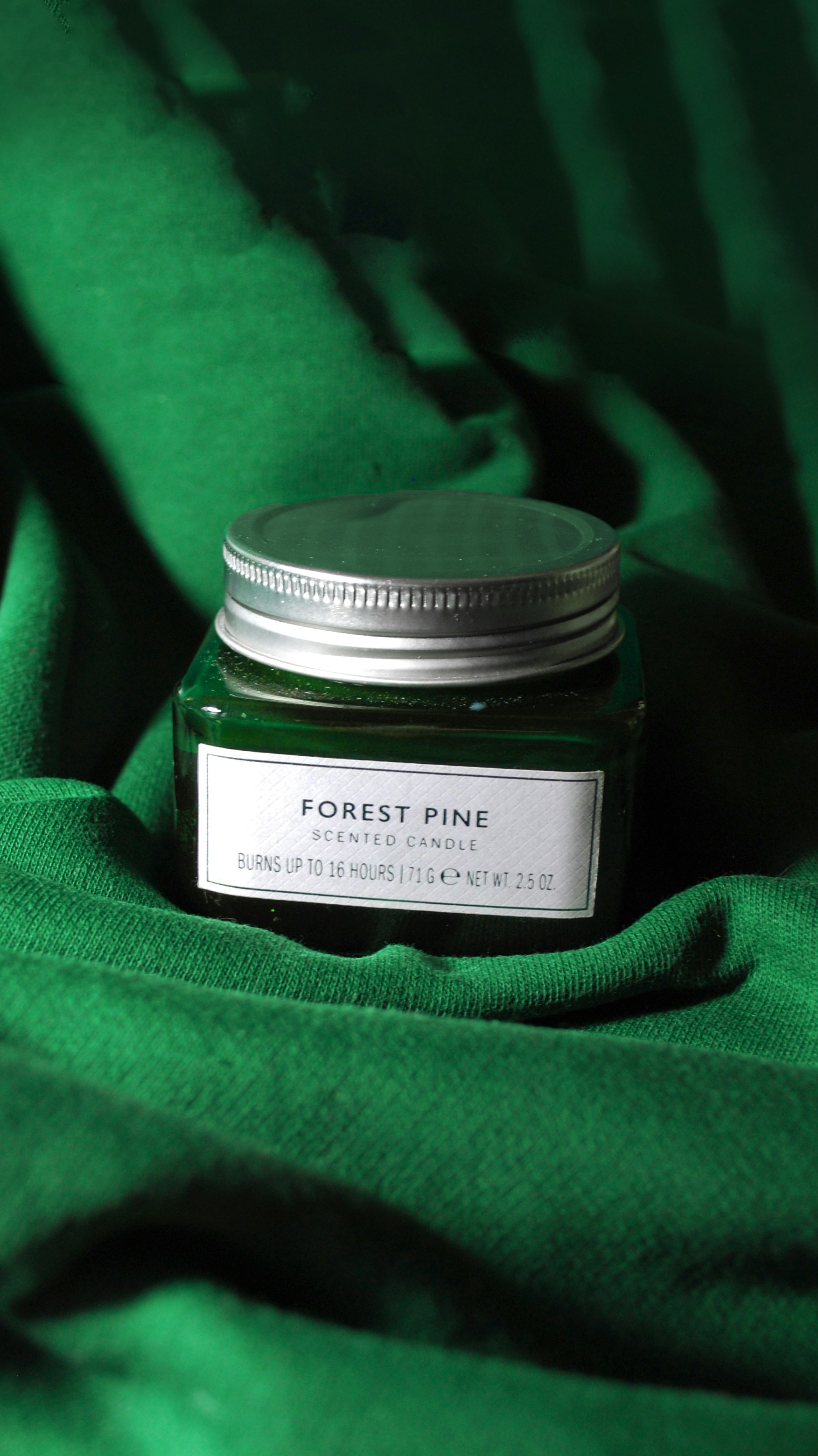 Forest Pine Candle: A Green-Glass Focus in Velvet Fabric