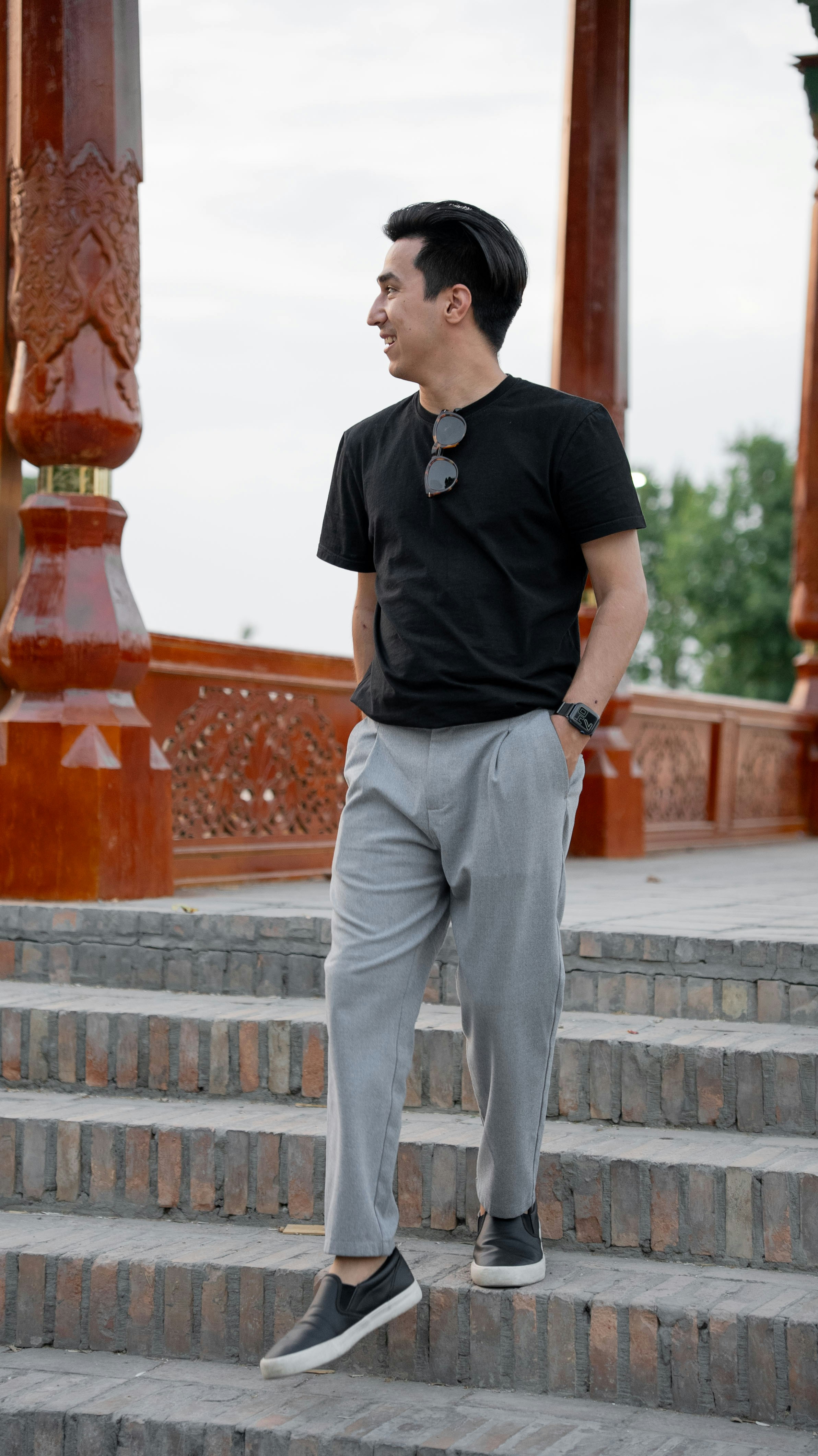 Mid-Cascade Stroll: A Quiet Moment on Red-Carved Steps