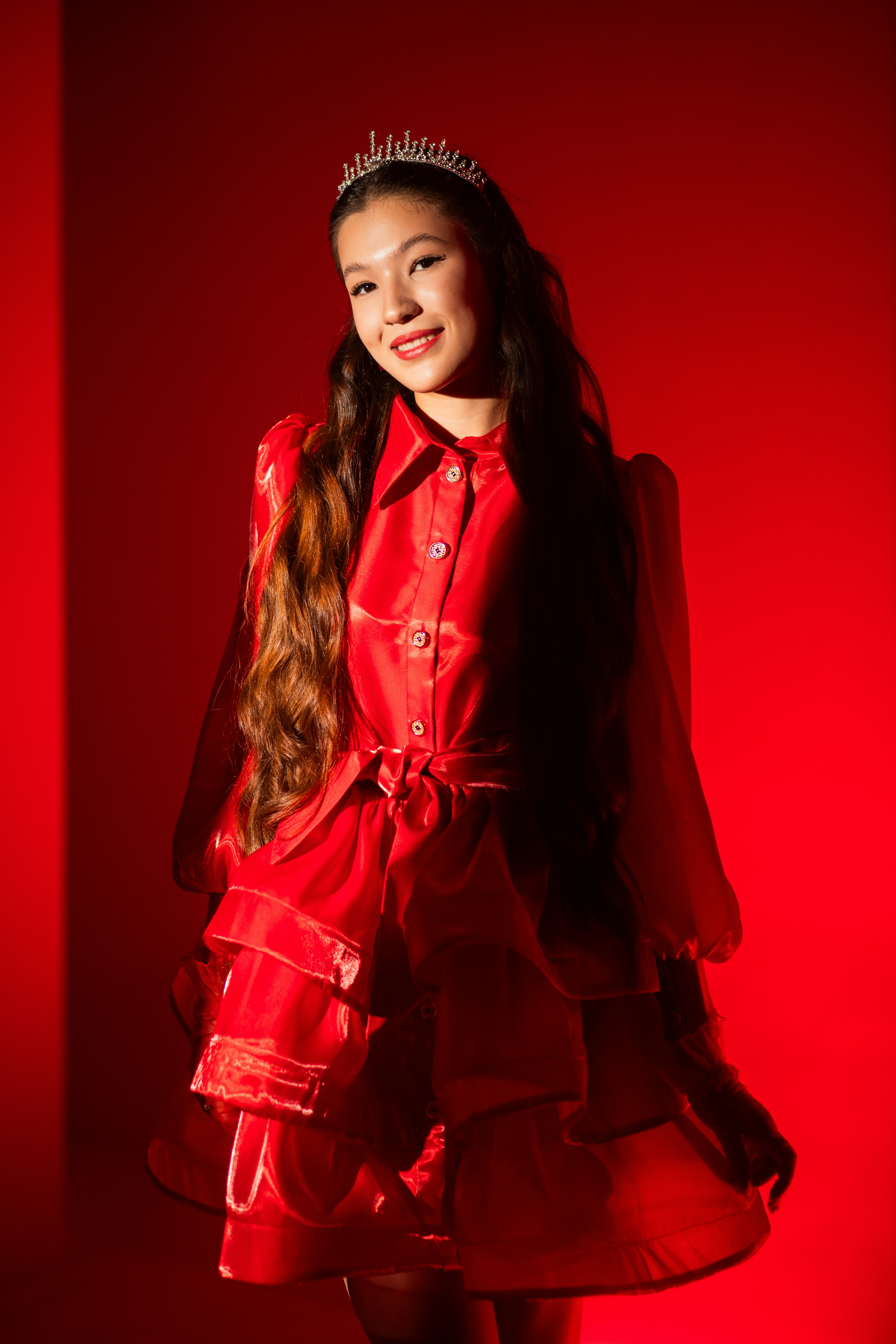 Crimson Crown: A Youthful Moment in Deep Red