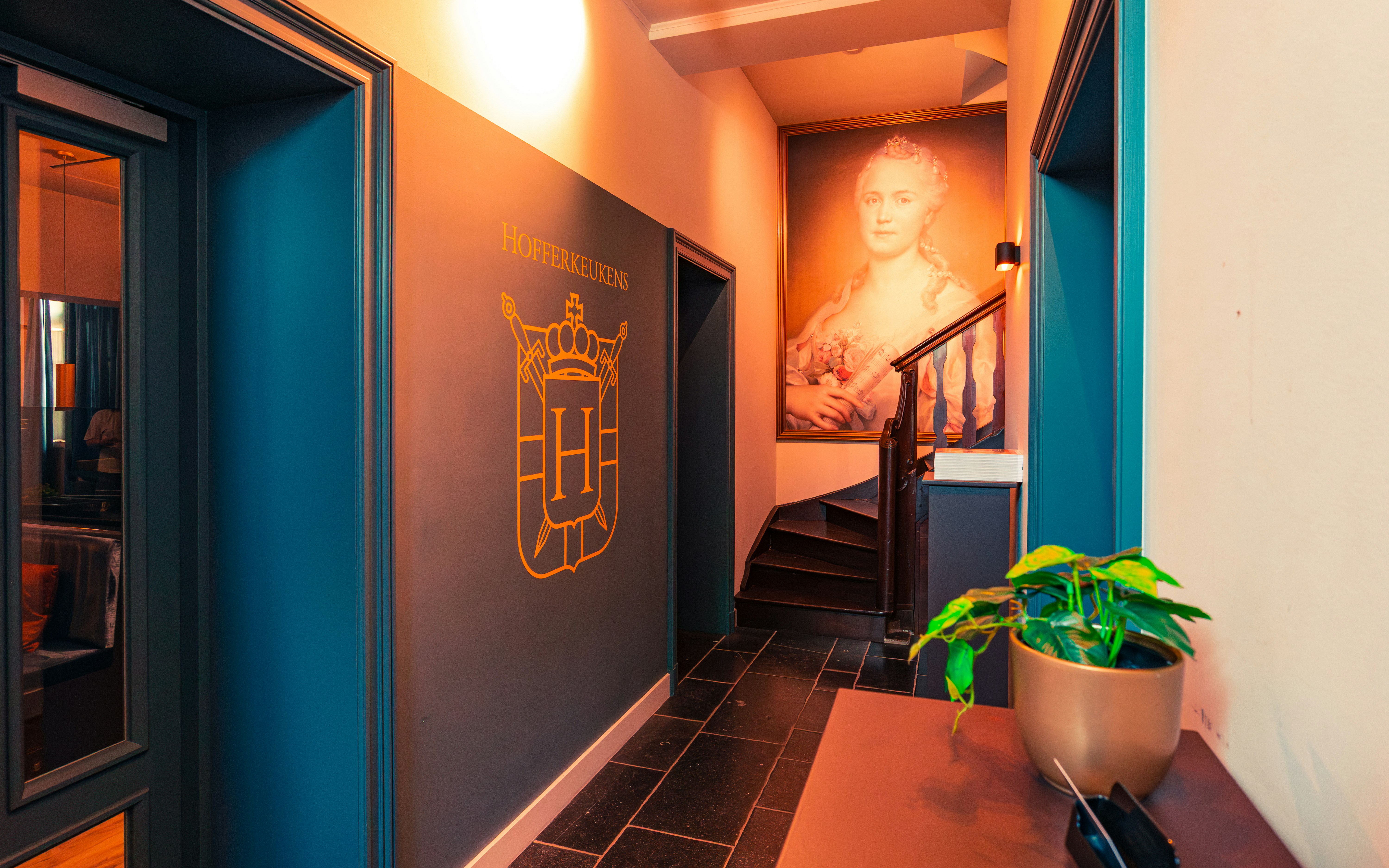 Hallway with portrait and staircase