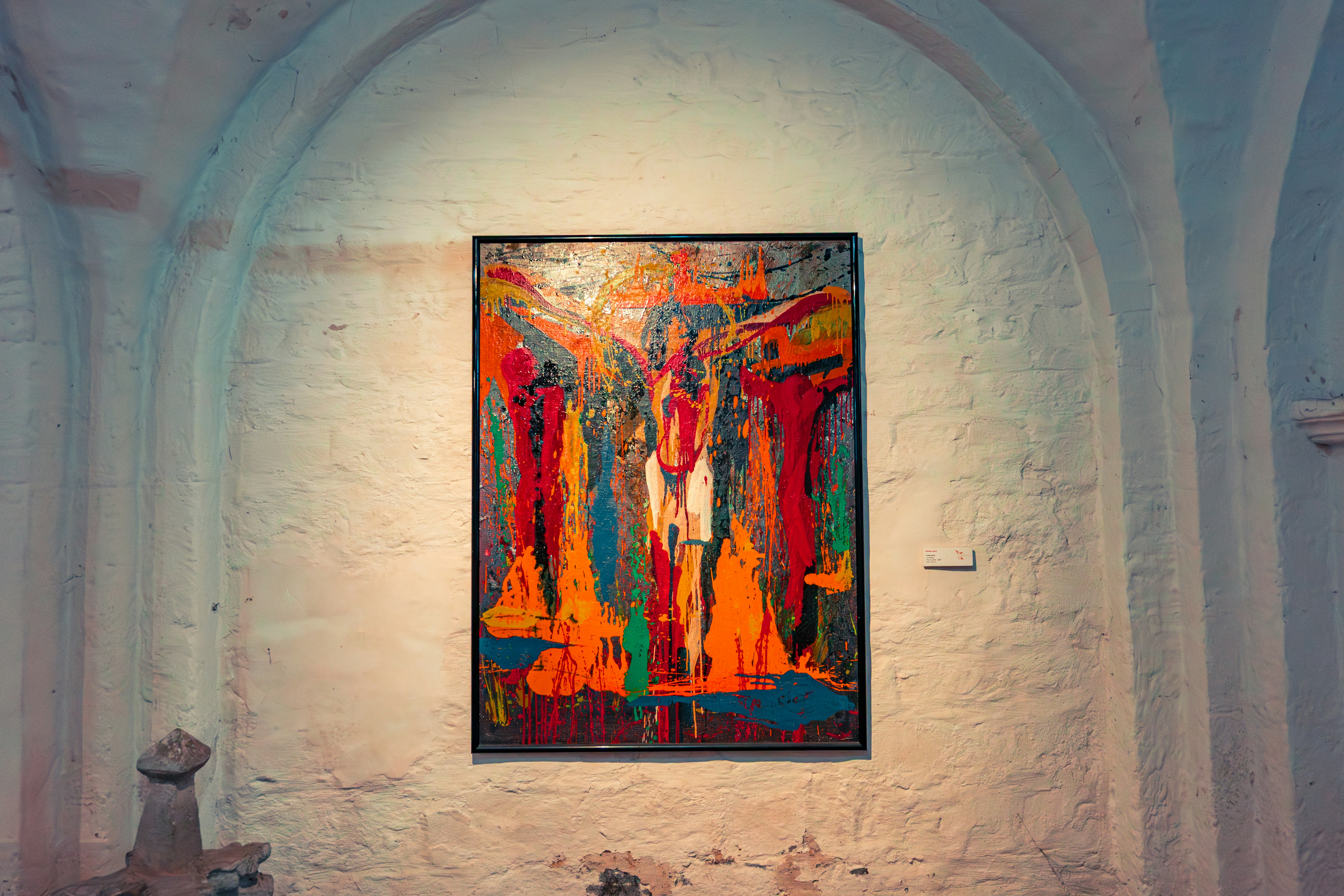 Vivid Artifact: Anfi Gallery Painting Anchored by Soft Spotlight