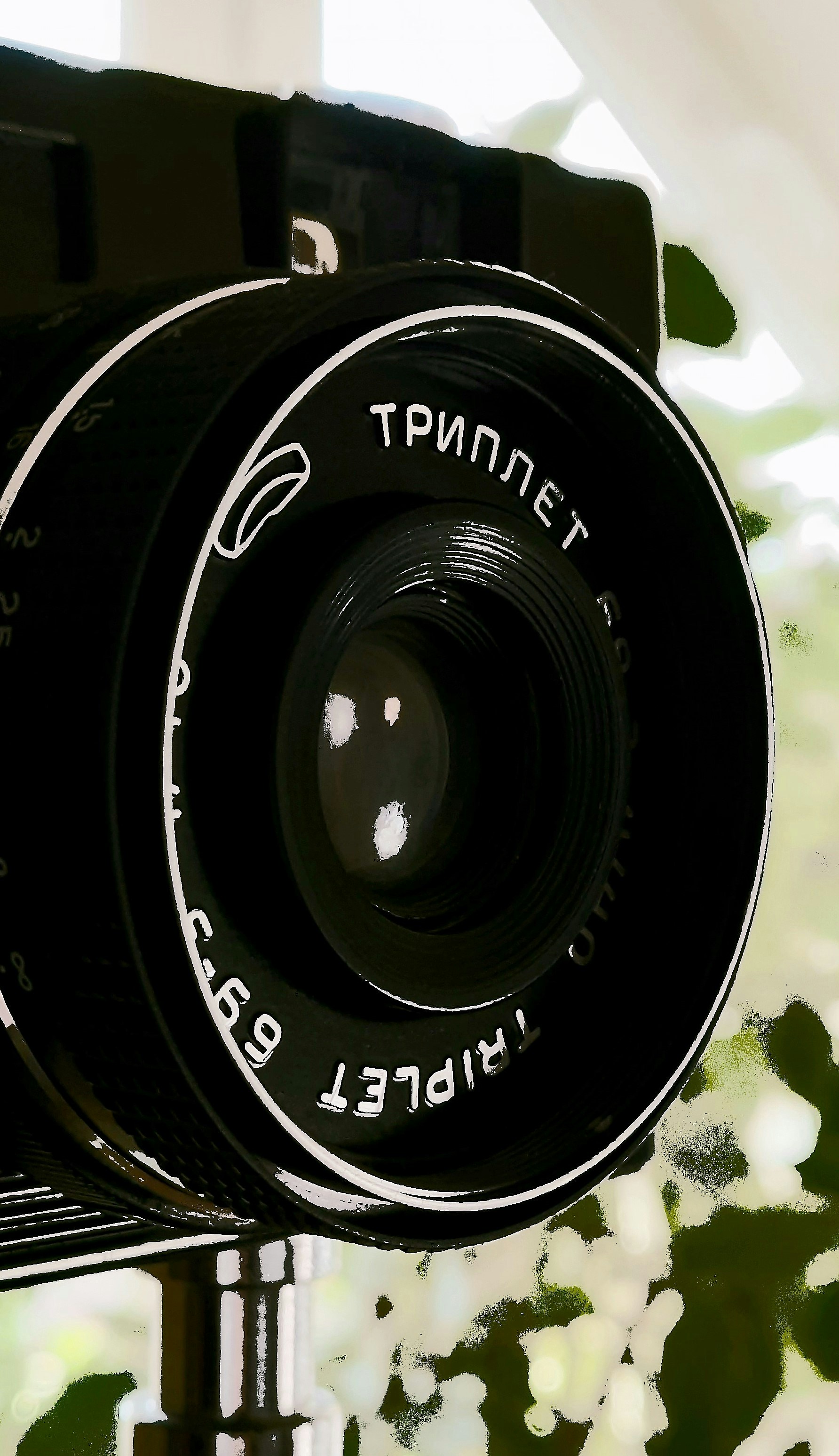 Vintage Lens, Modern Moment: A Close-Up of a Triplet Prime on Display