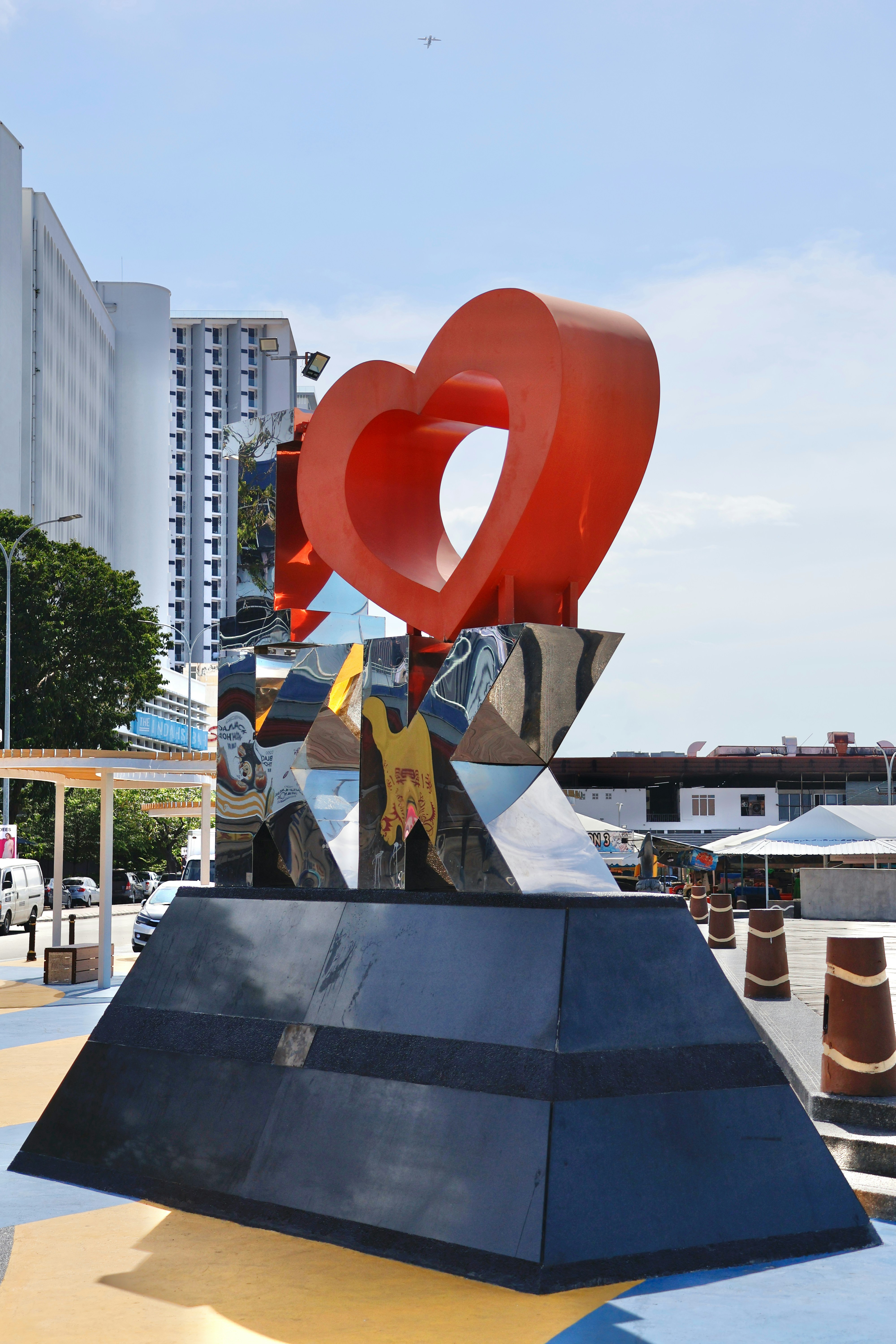 Red Heart Monument: A Façade of Reflections under a Clear Sky