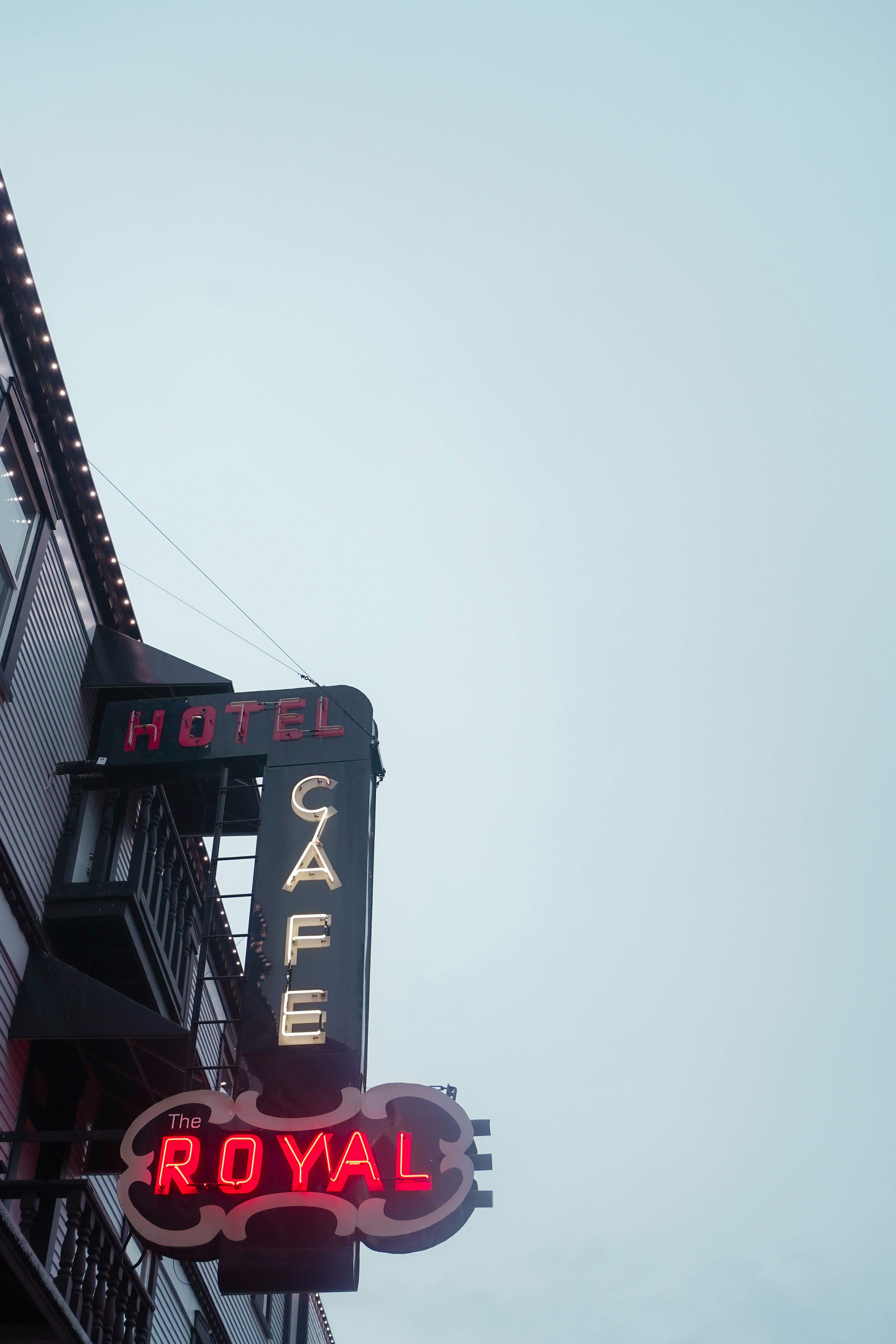 Neon Signage over a Sunset-Cooled Facade