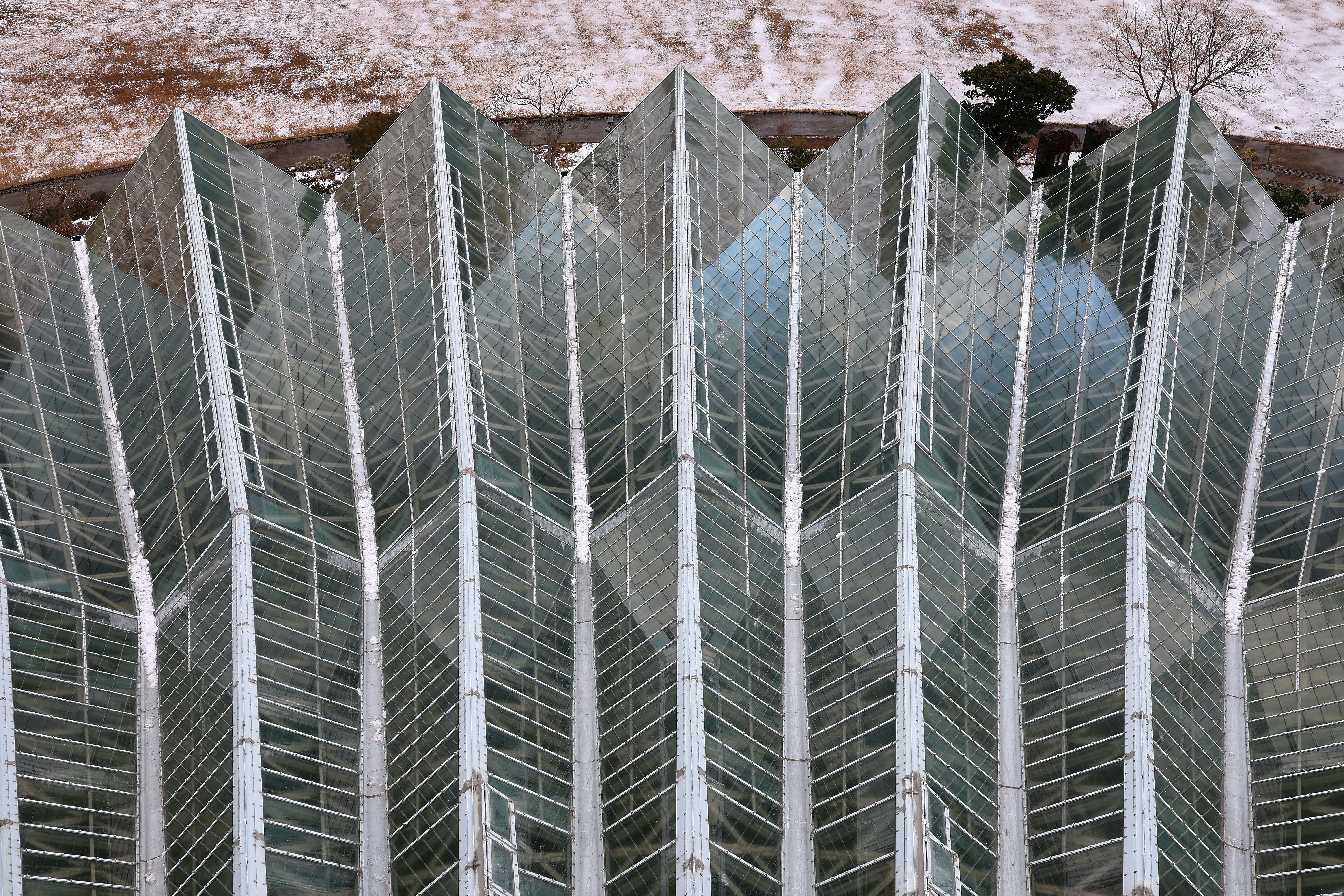 Gleaming Geometric Facades: A Sea of Glass Peaks