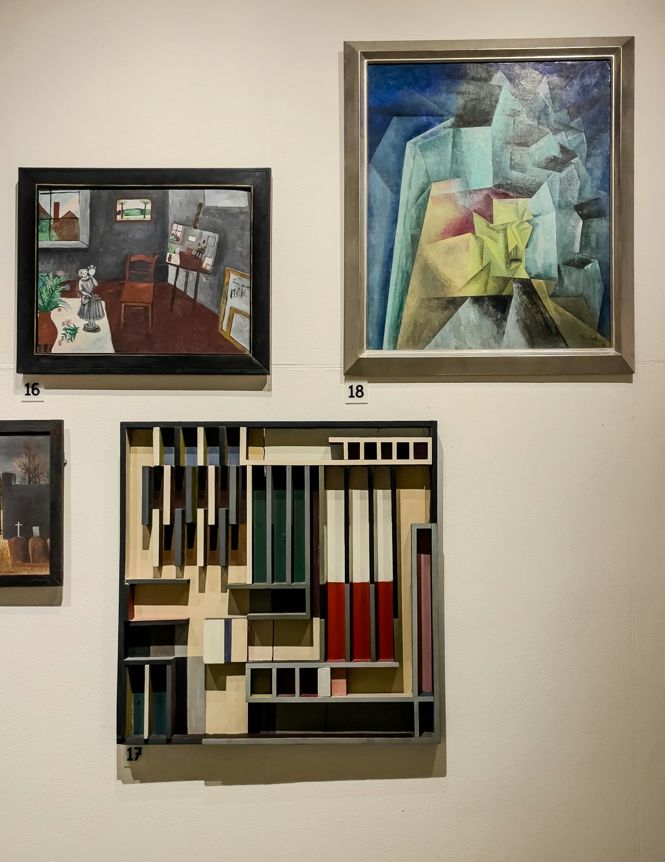 Geometric Stillness: Abstracts and Miniatures on a Gallery Wall