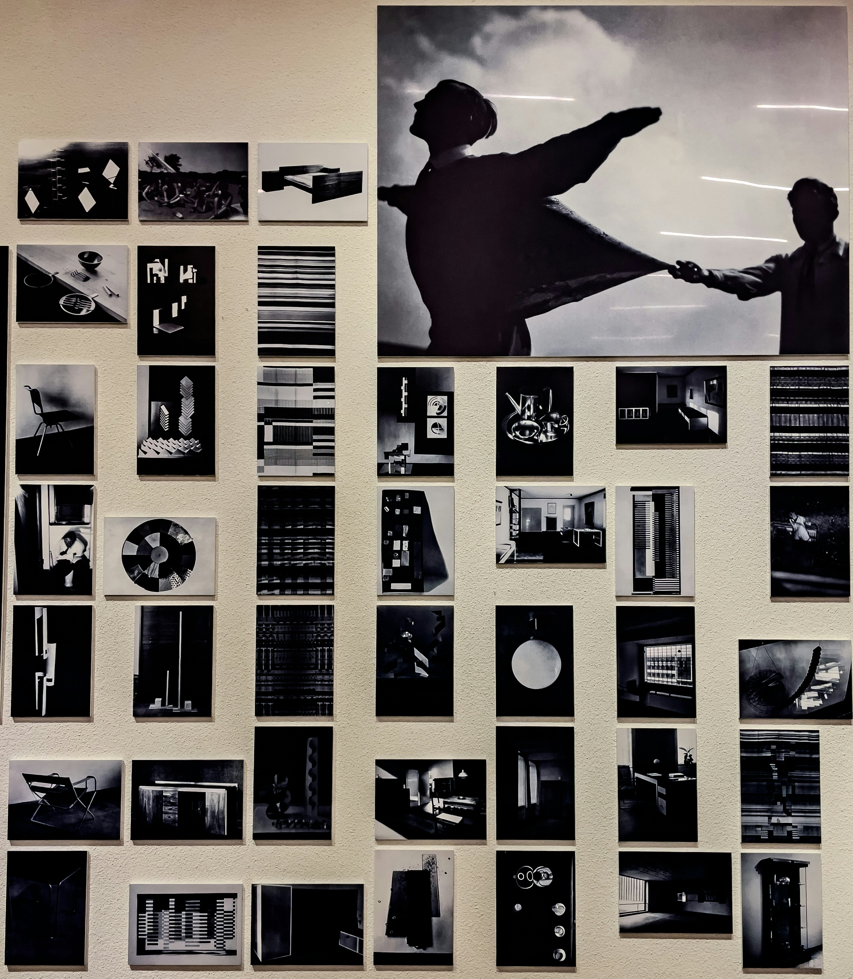 Mosaic of Echoes: Black-and-White Snapshots on a Gallery Wall