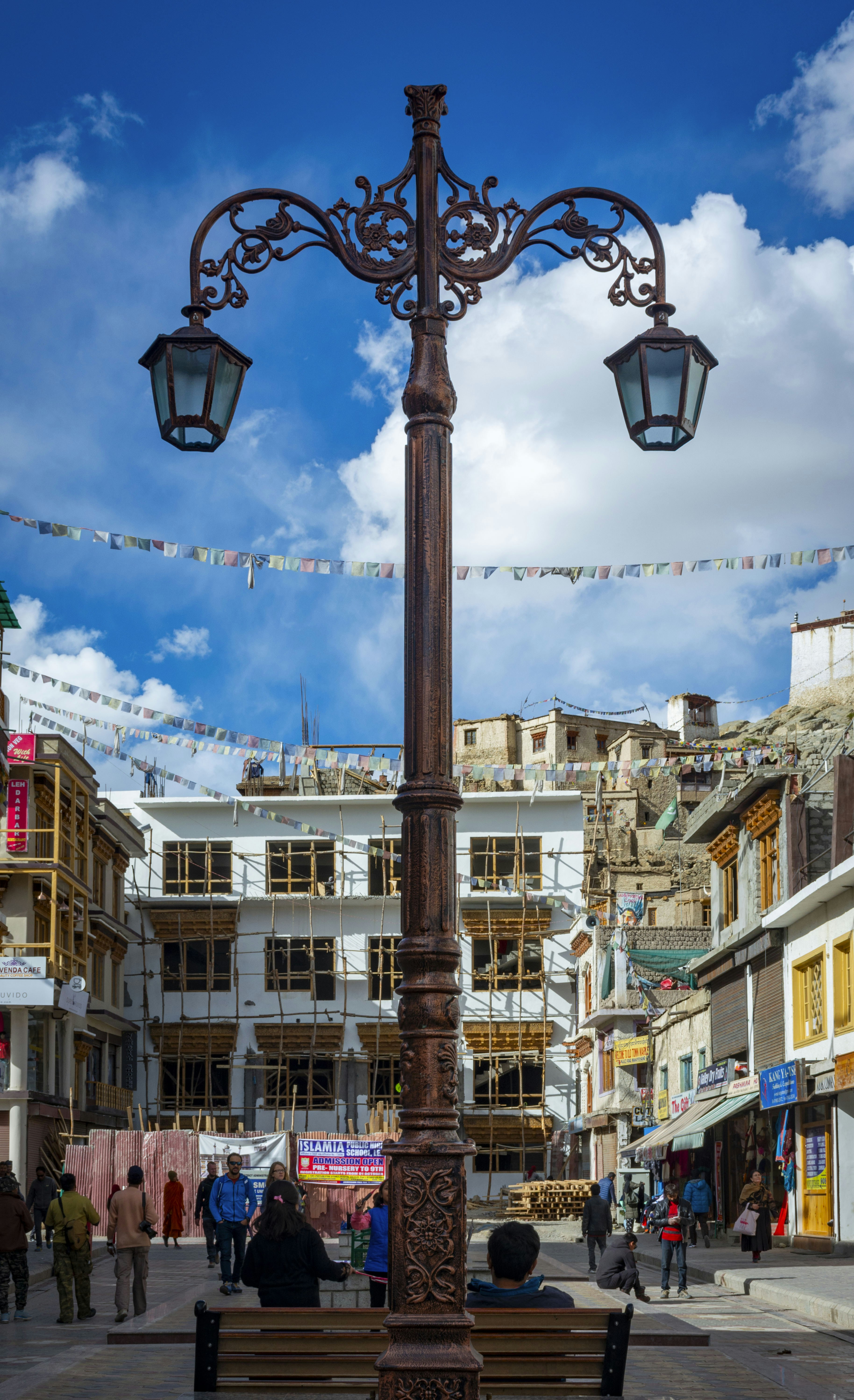 Ornate Lamp Post Framing a Bustling Street