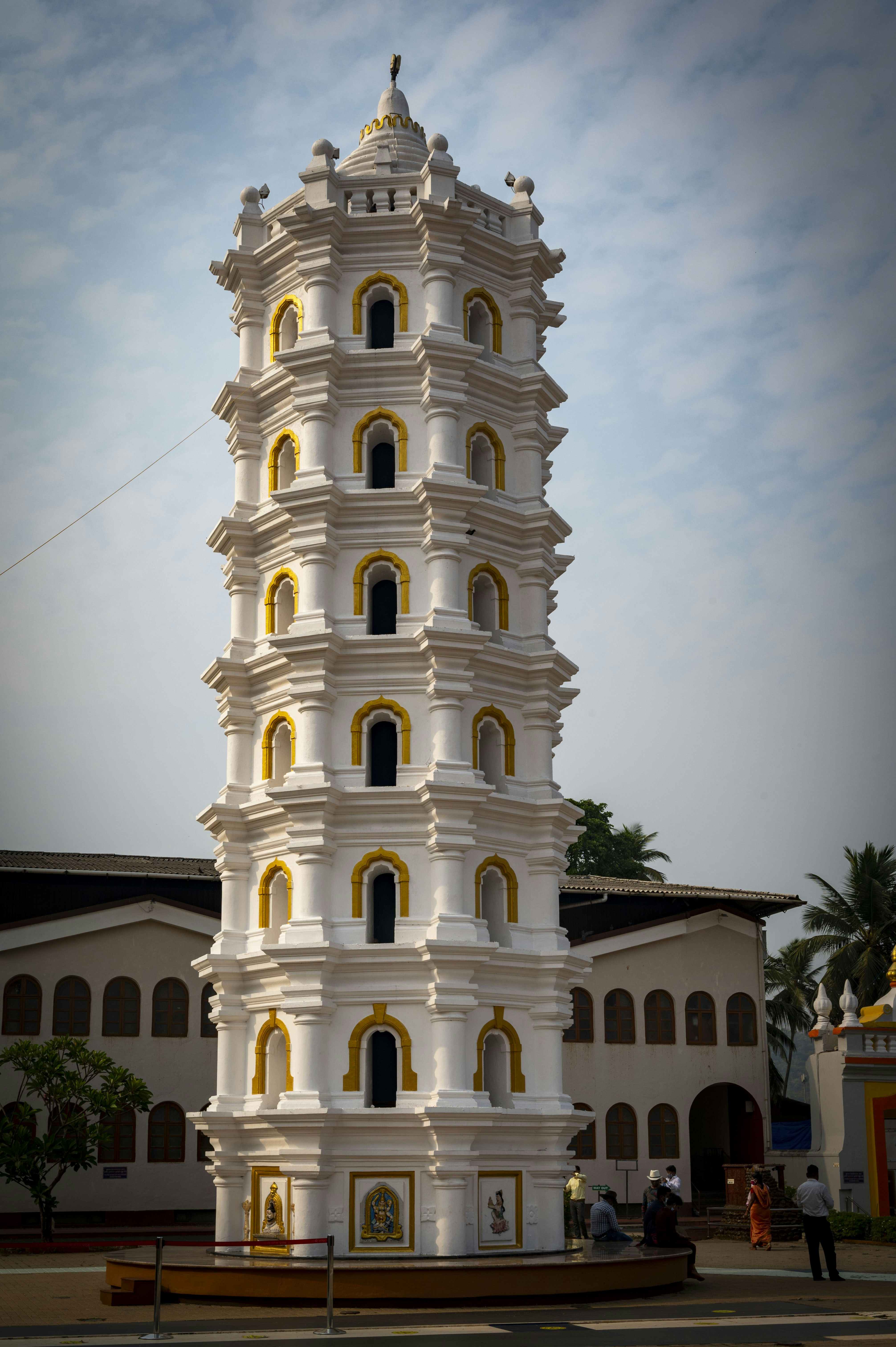 The White Temple Tower Reaching Toward a Clear Sky
