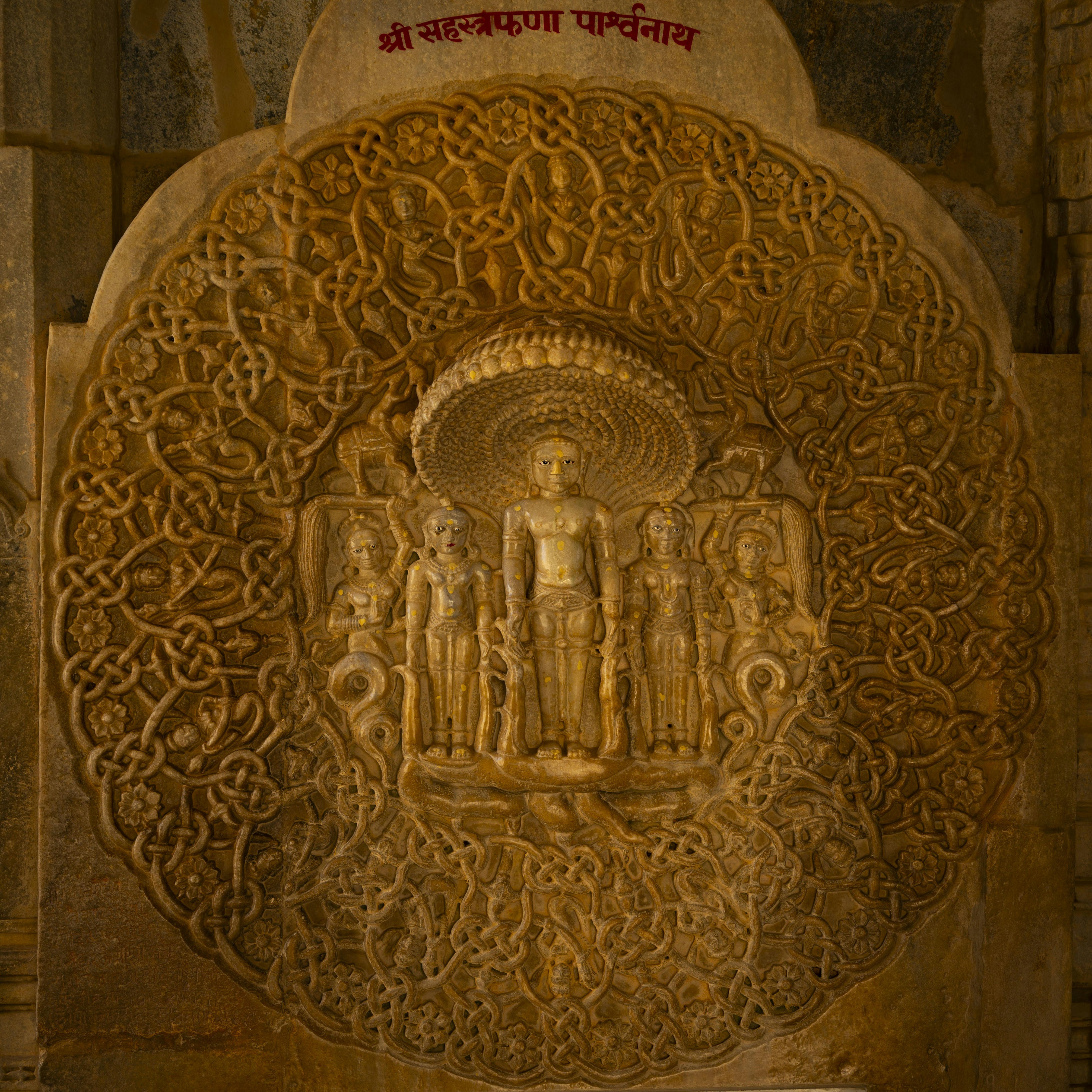 Central Buddha Framed by an Intricate Circular Carving