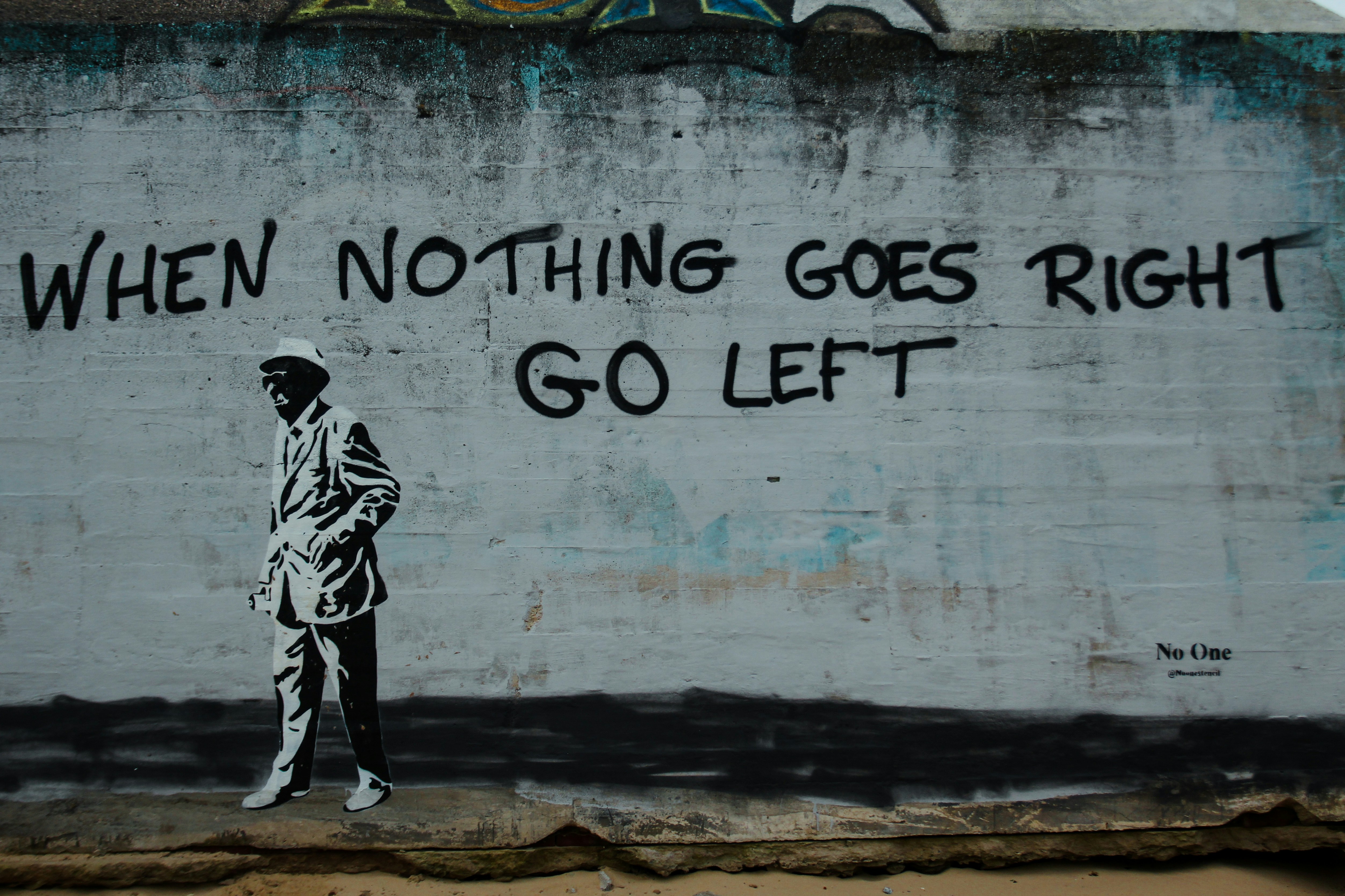 When Left Is Right: A Lone Figure Under Pithy Graffiti