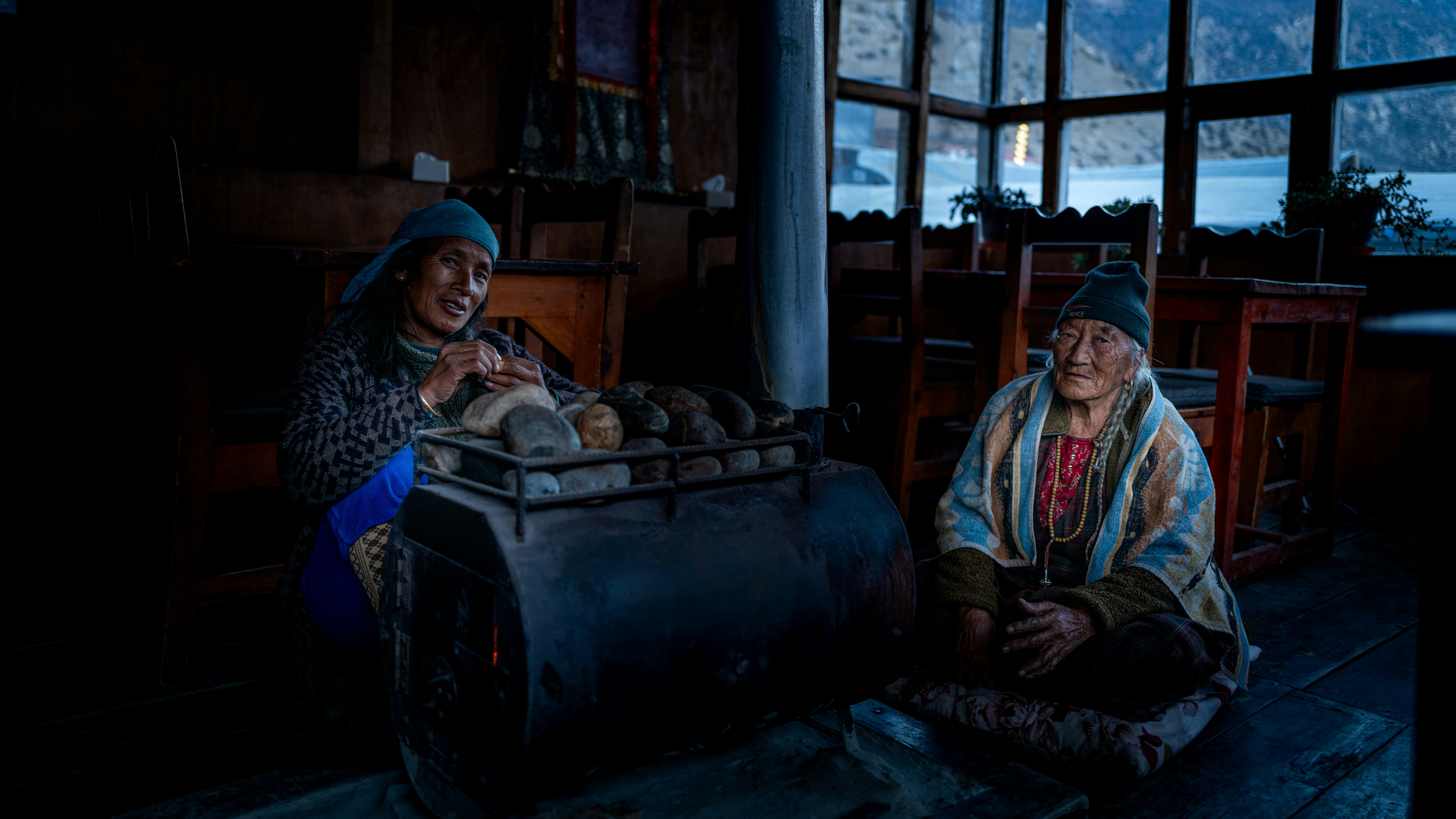 Hushed footsteps by the stove: a quiet moment between two caregivers