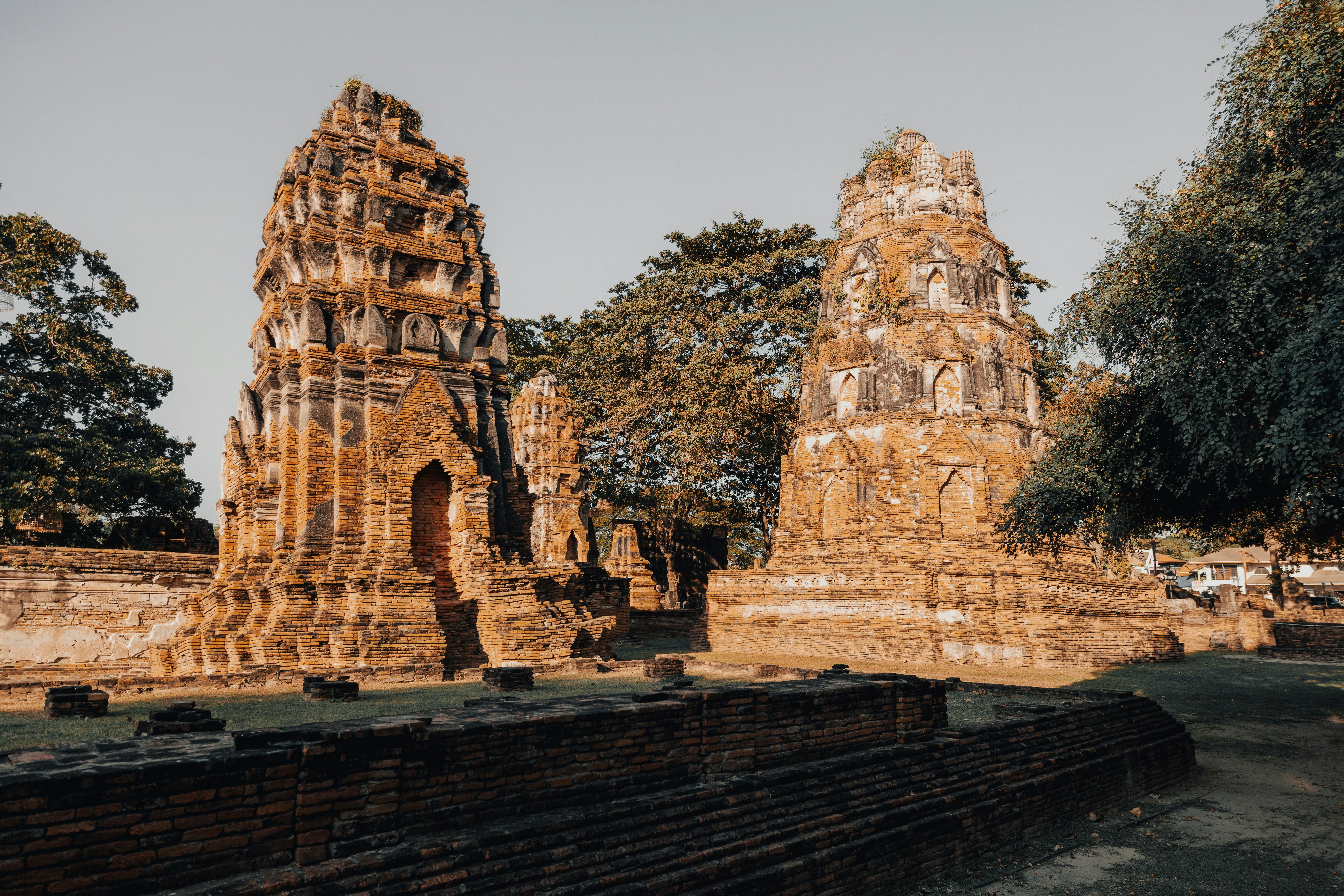 Ancient stone ruins of temples in a grassy field. photo – Free Travel ...