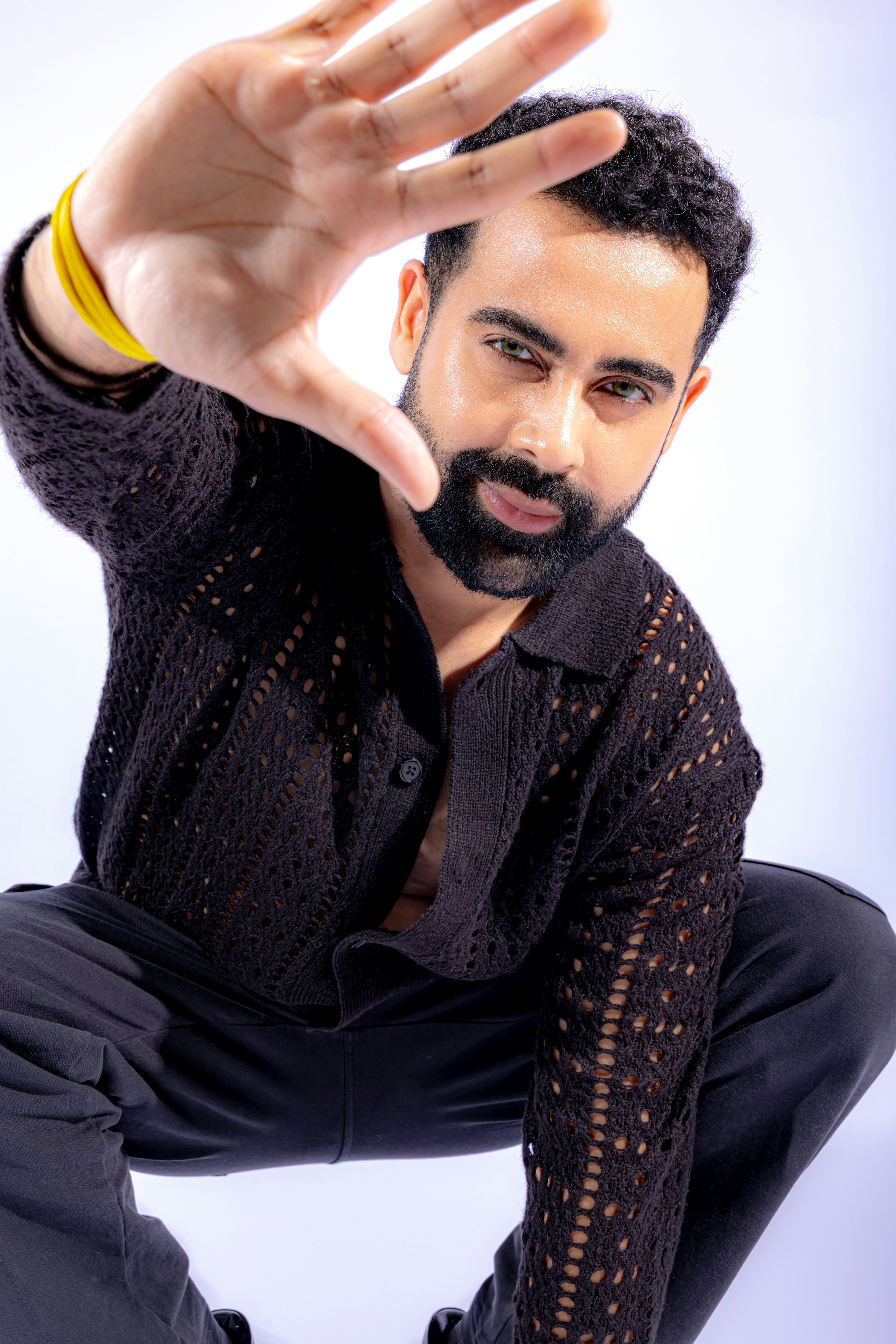 Frontal Reach: A Confident Pose Framed by an Outstretched Hand
