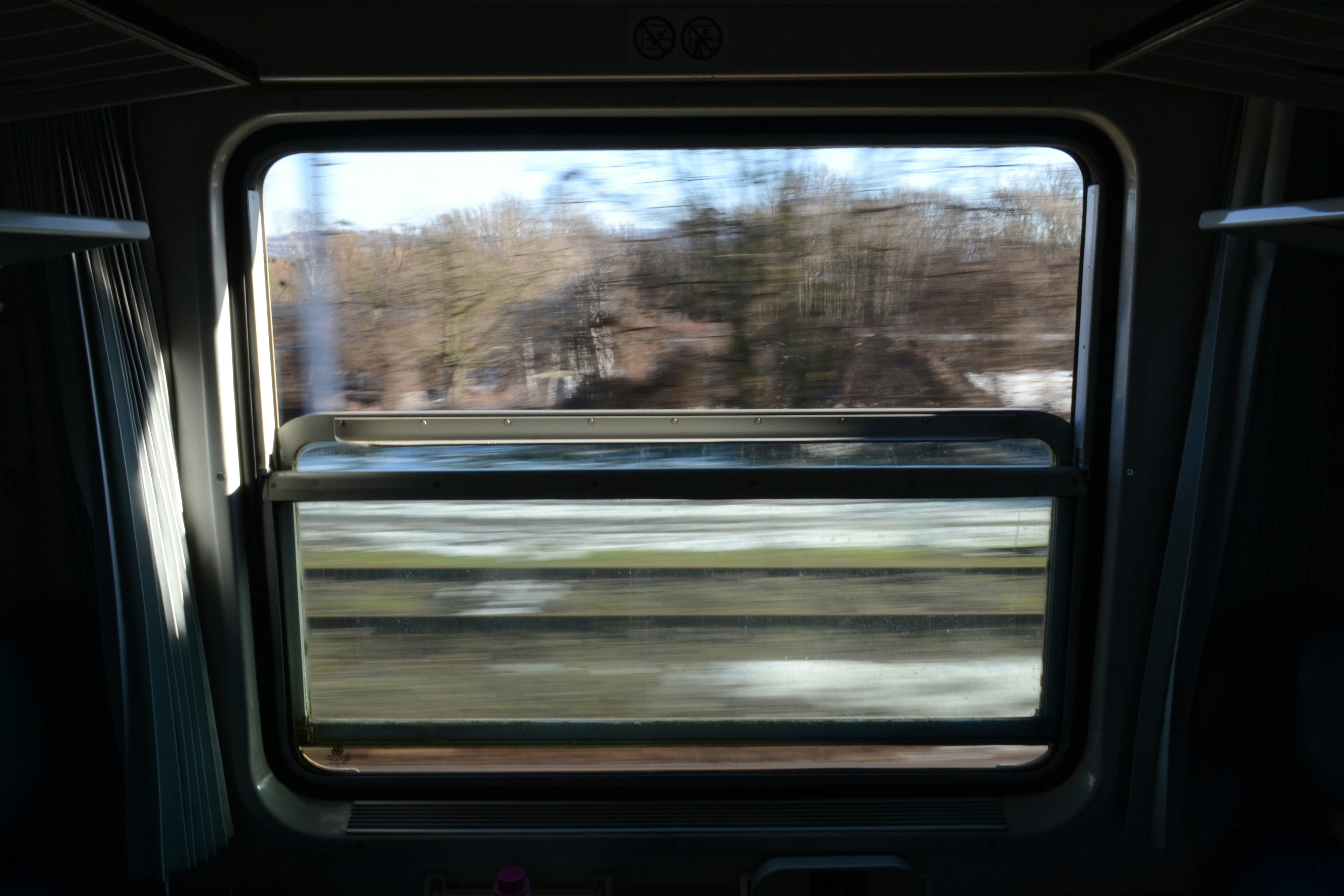Window View from a Moving Train: Blurred Landscape Through the Car Window