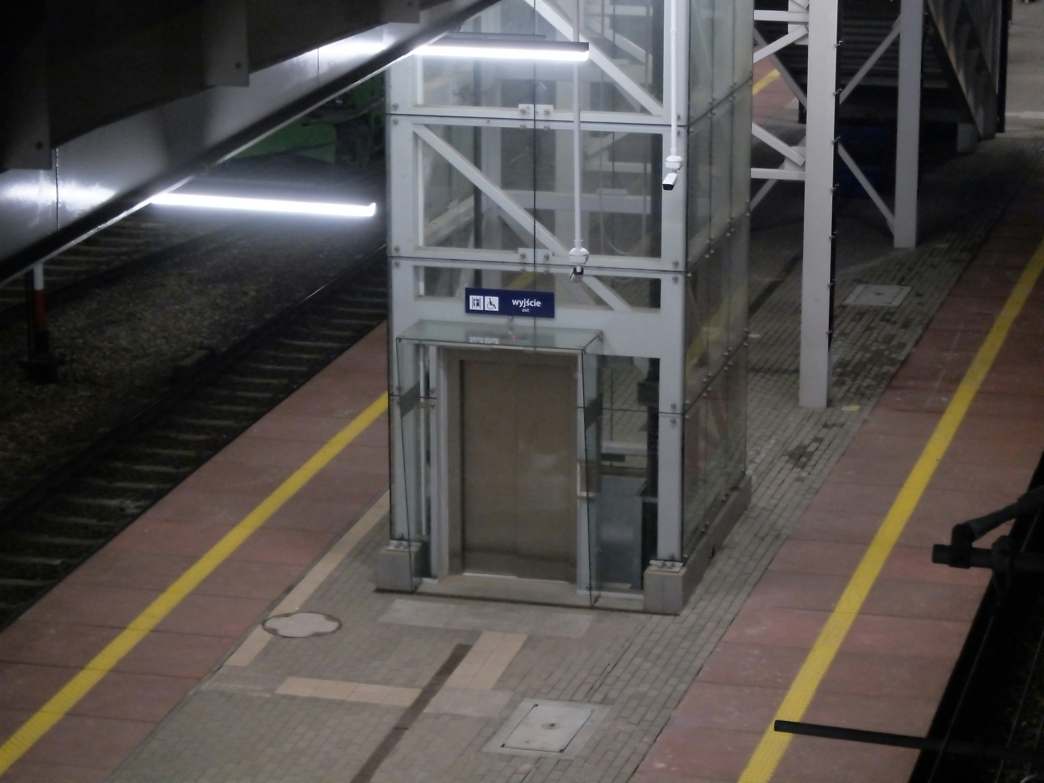 Glass elevator enclosure at a train station platform