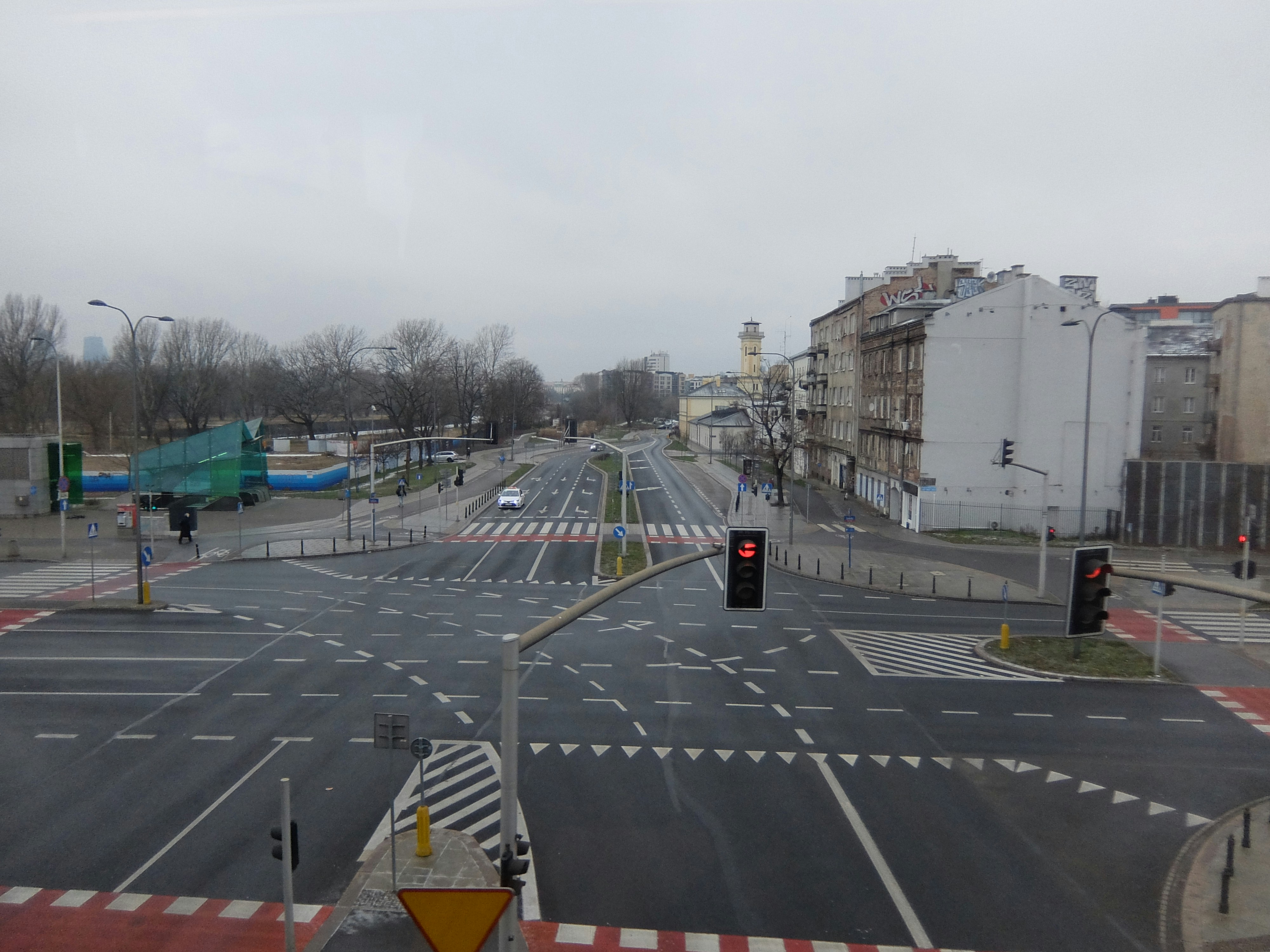 An intersection with traffic lights and buildings