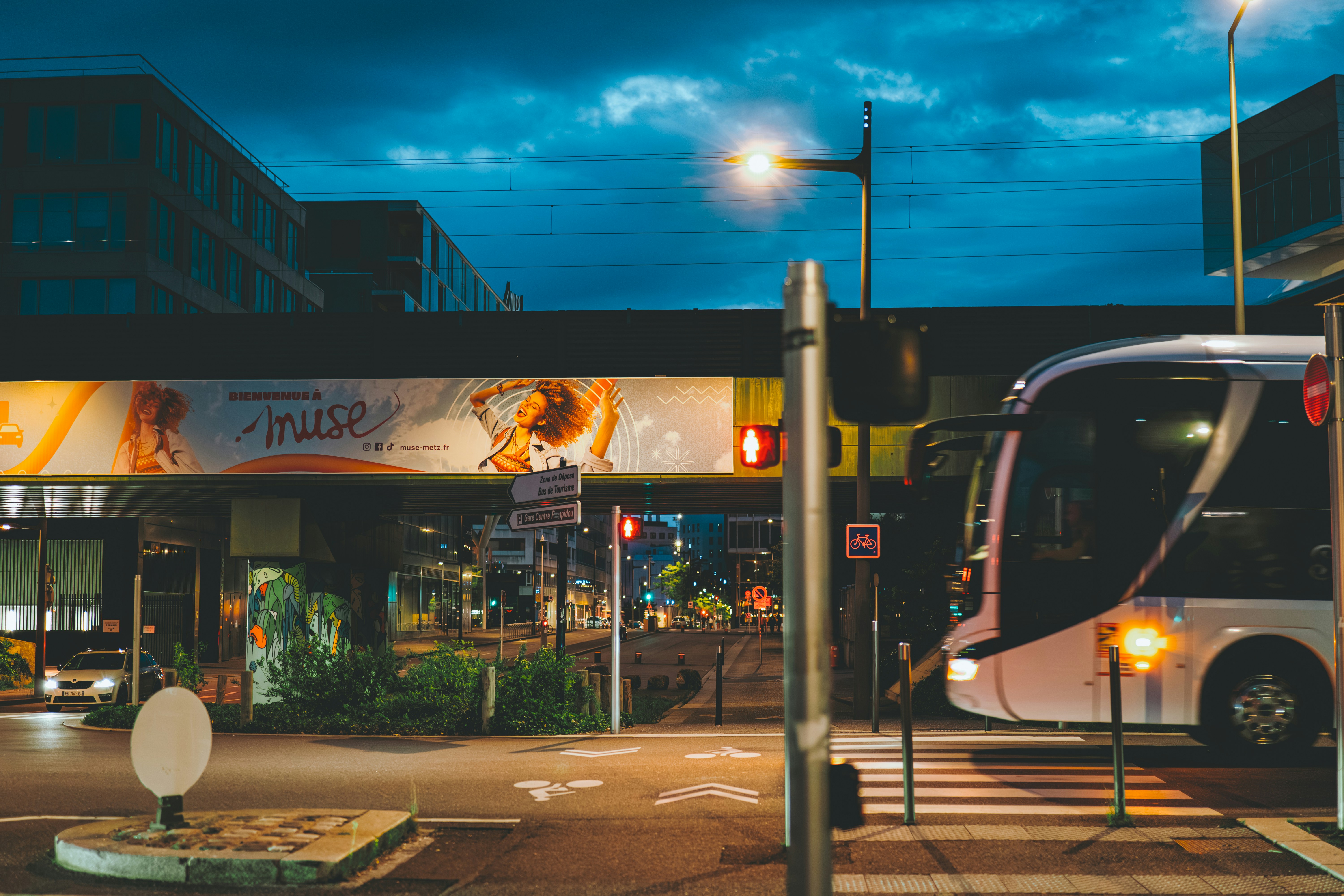 City Night Echo: A Bus Gliding by Under Neon Echoes