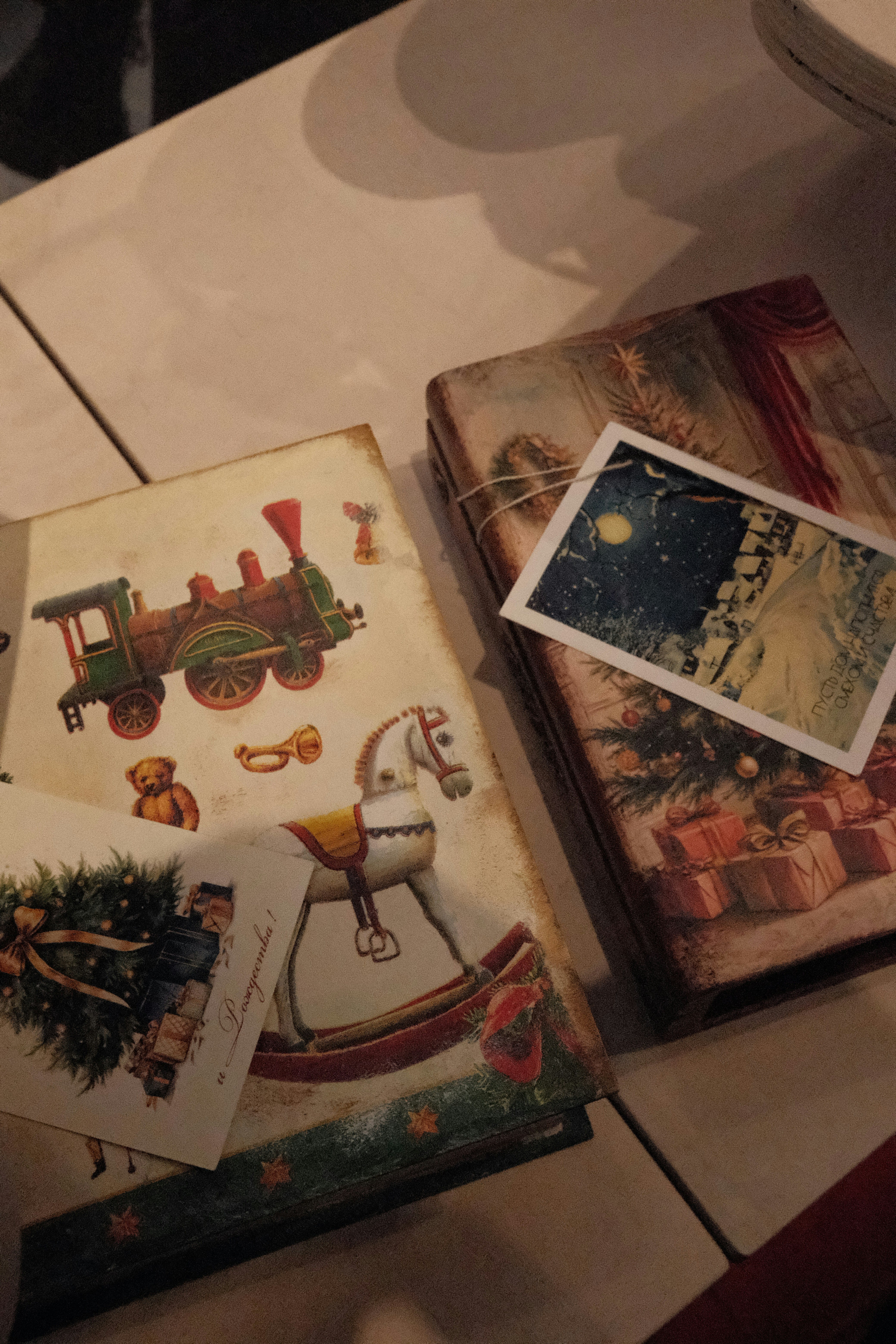Vintage Holiday Keepsakes: Festive Cards amidst Antique Sketches