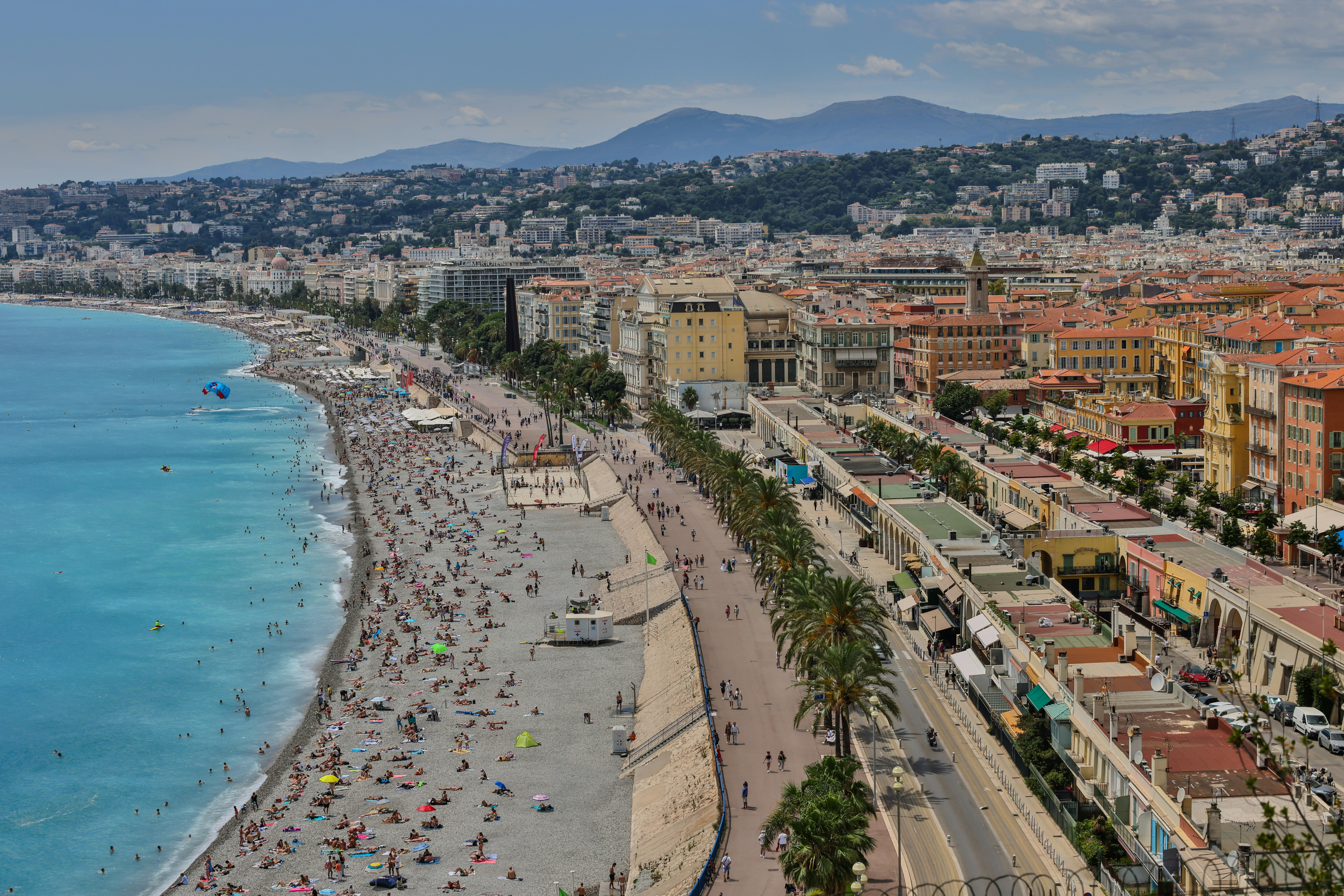 Mediterranean Seaside Boulevard: A Sunlit Beachside Panorama
