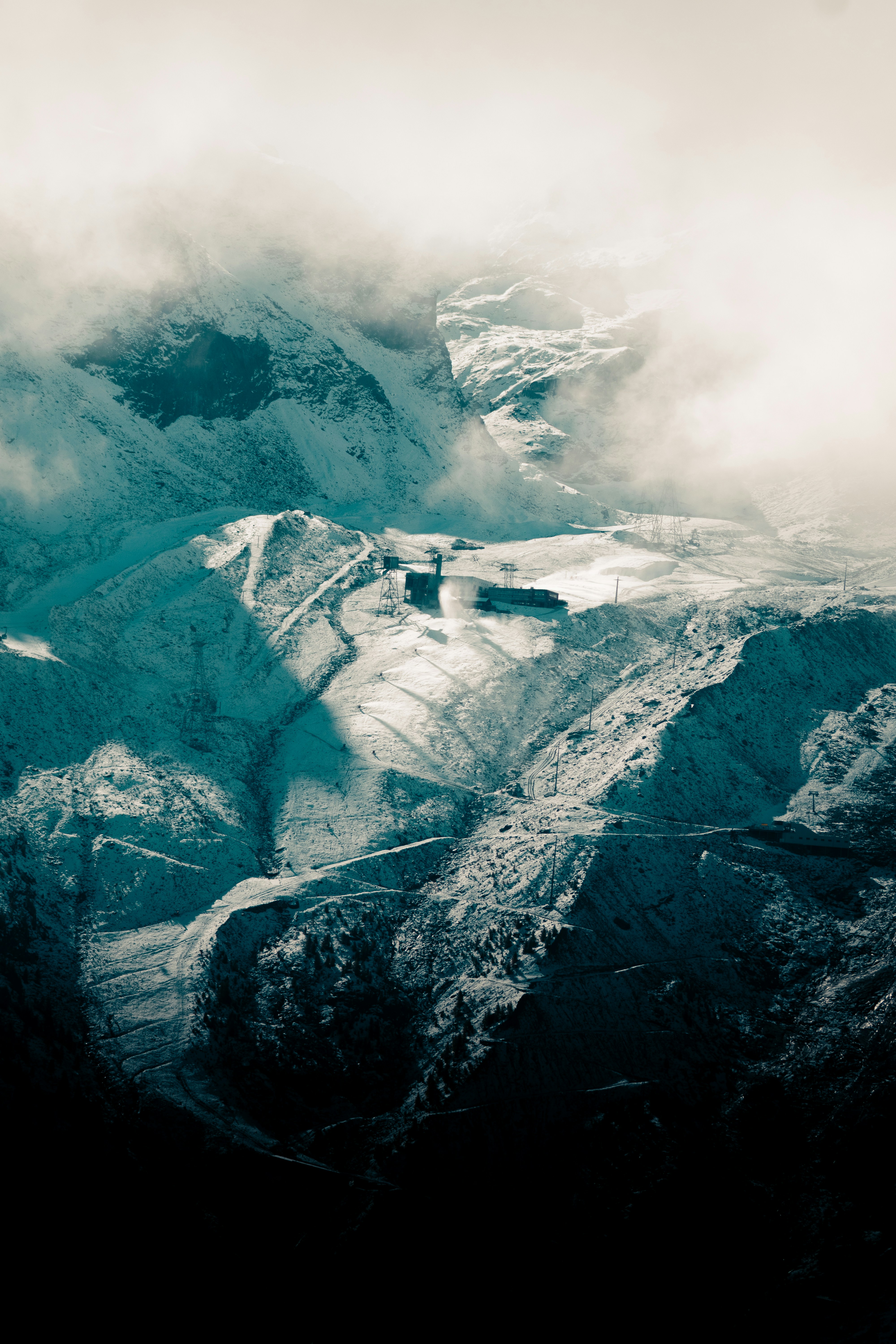 Snowbound Ridge: A Snowfield Shrouded in Cloud and Shadow