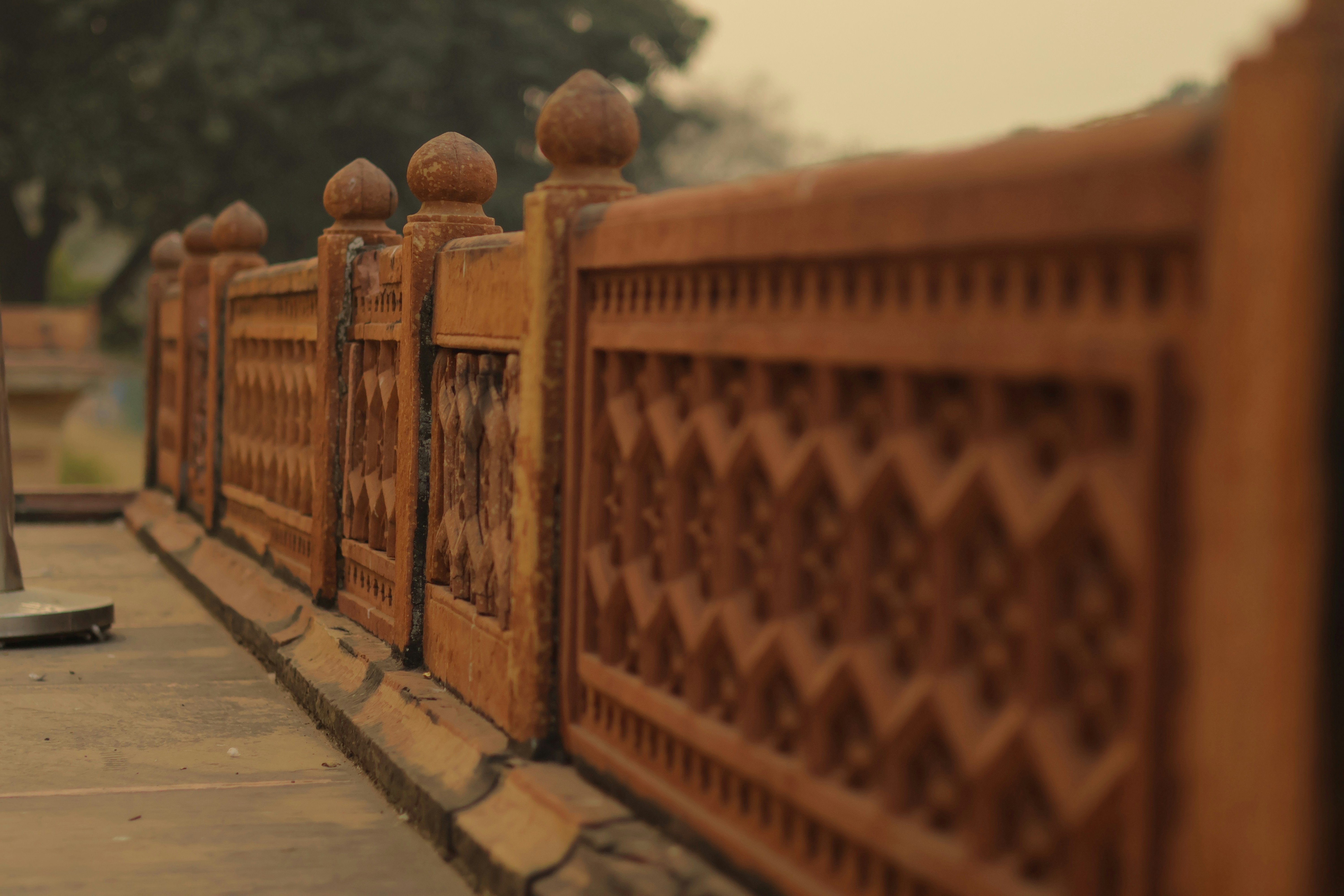 slanted view of a old mughal styled railing on side of safdarjung tomb