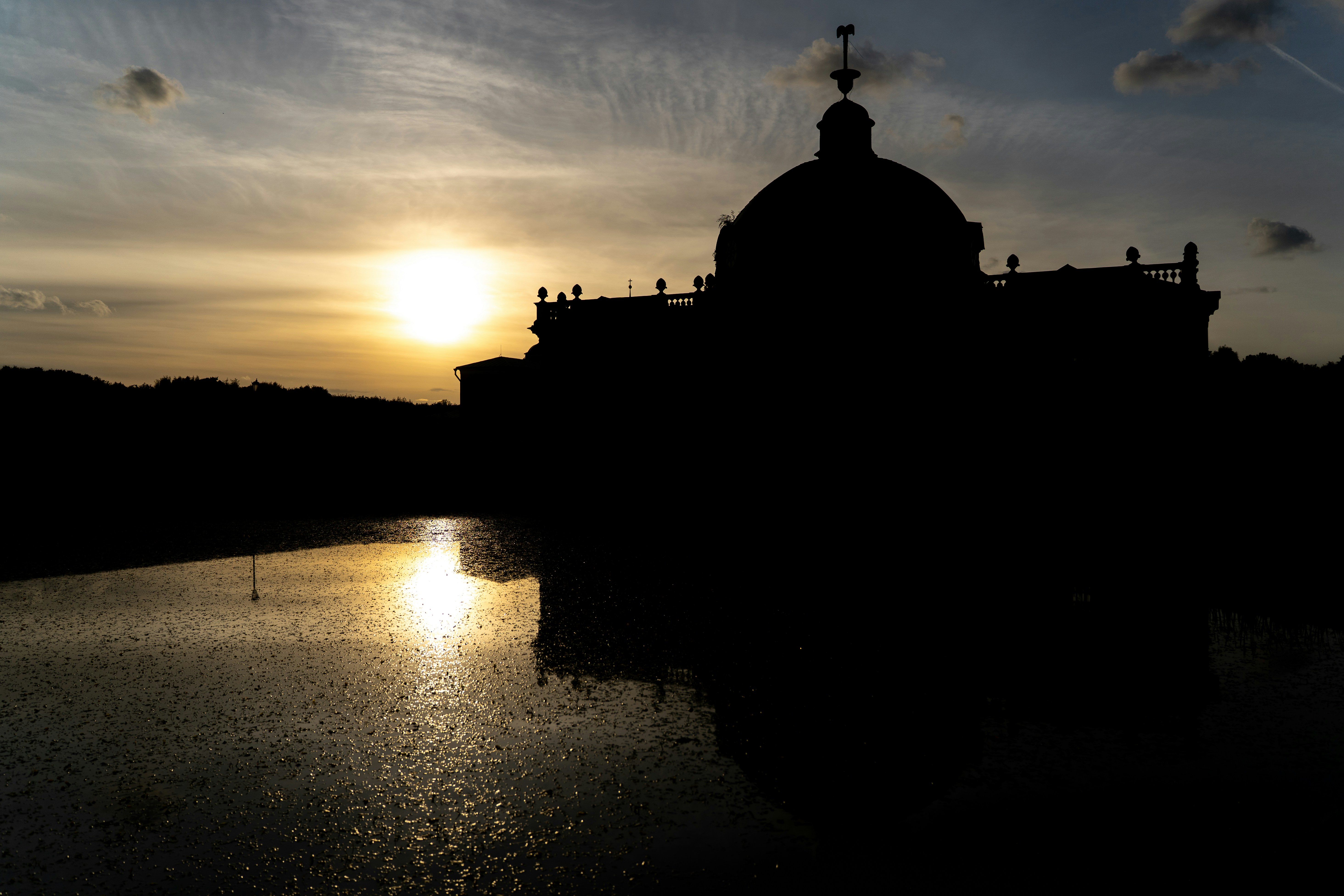 Sunset Silhouette Over a Domed Pavilion