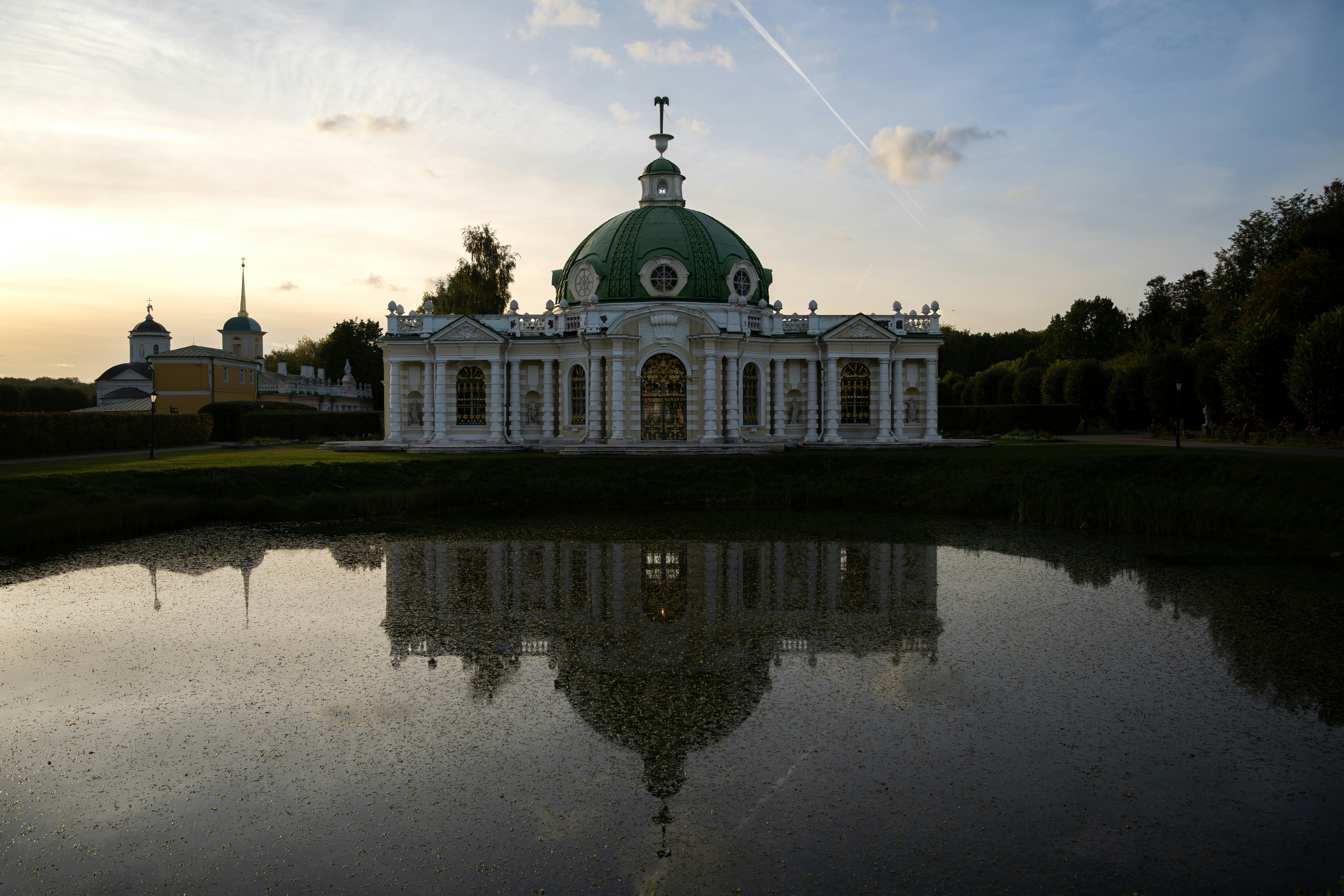 Symmetrical Pavilion by the Reflective Pool at Dusk