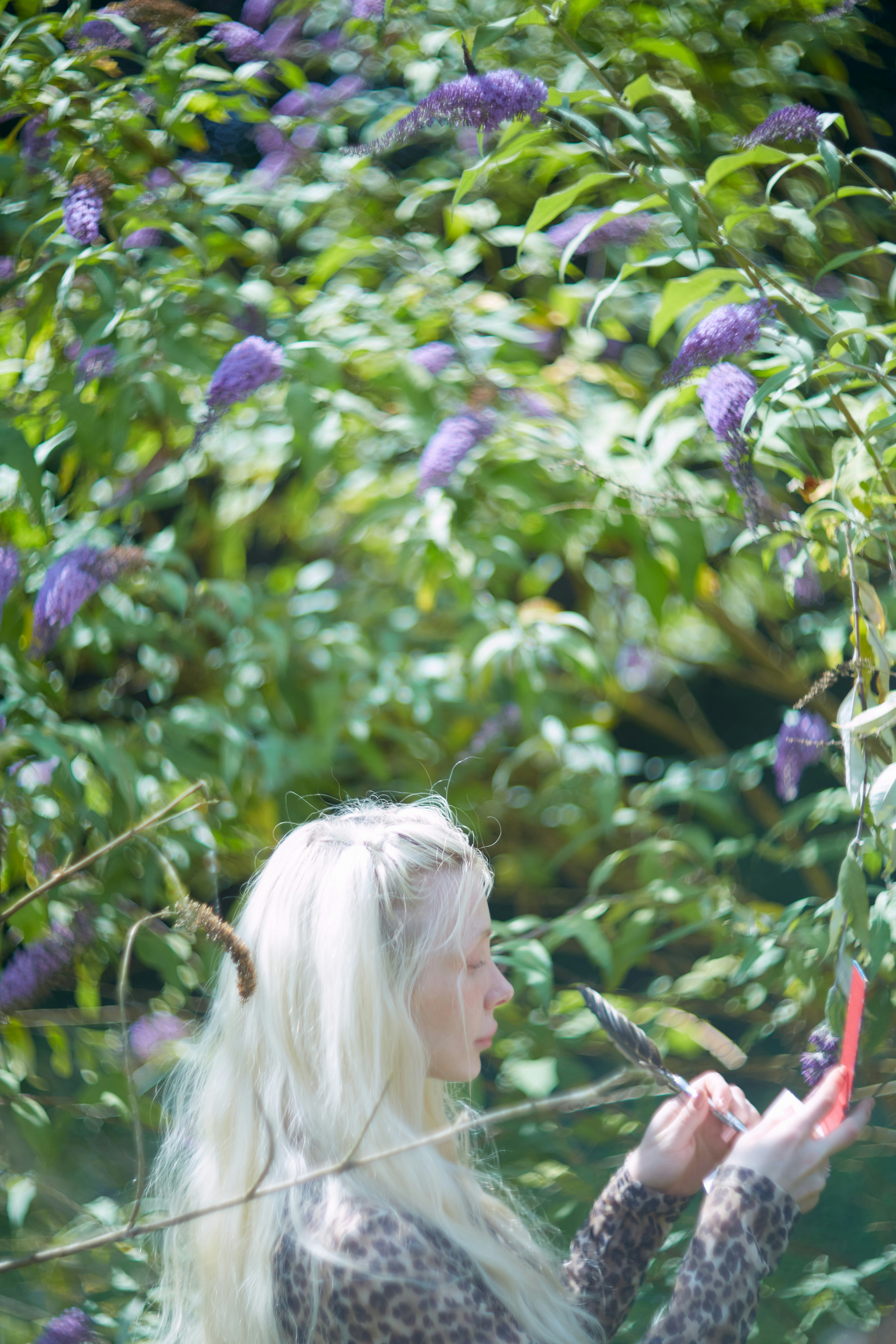 Blonde Portrait Amid Purple Blooms