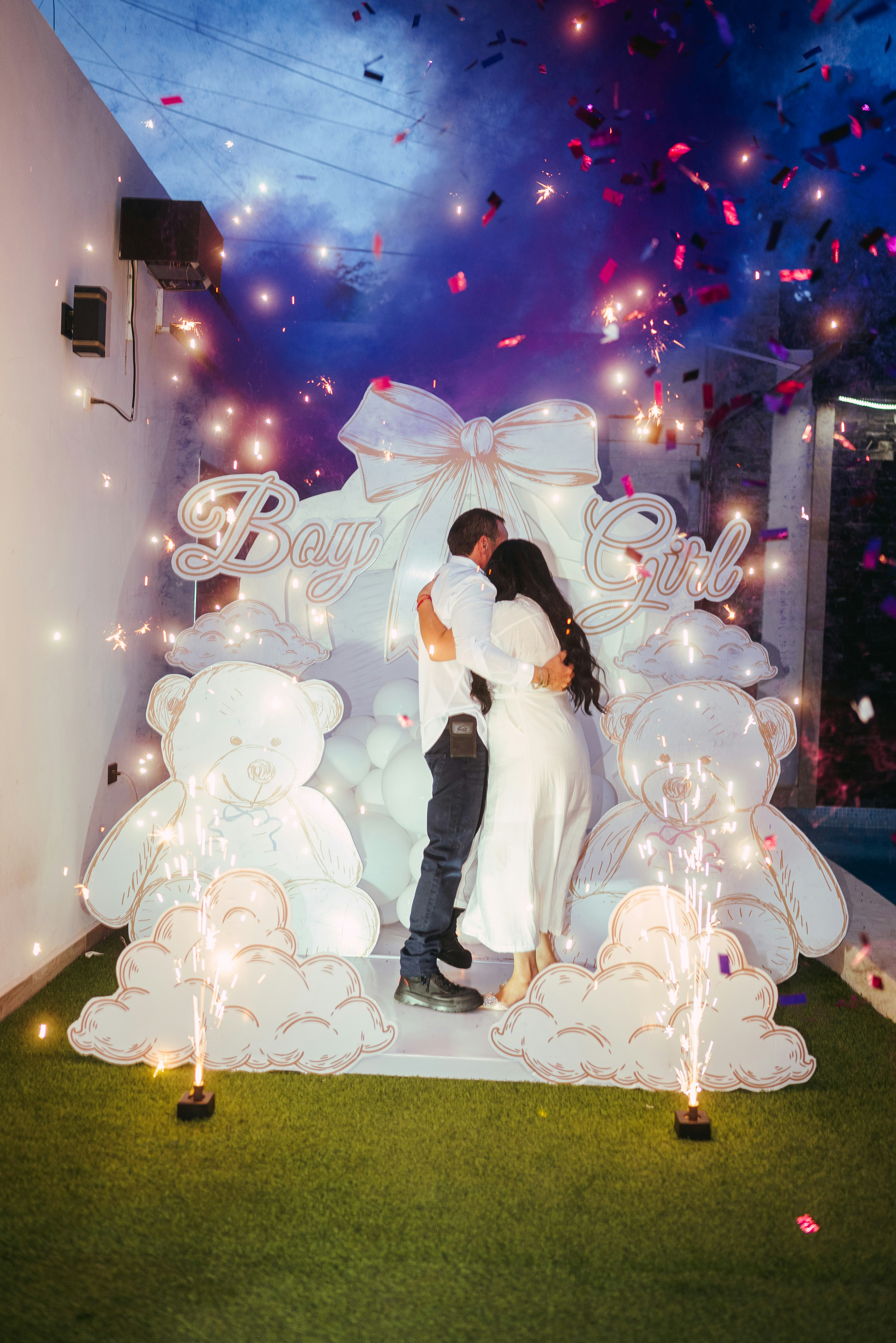 The Moment Under Neon Clouds: A Gentle Kiss at the White Arch