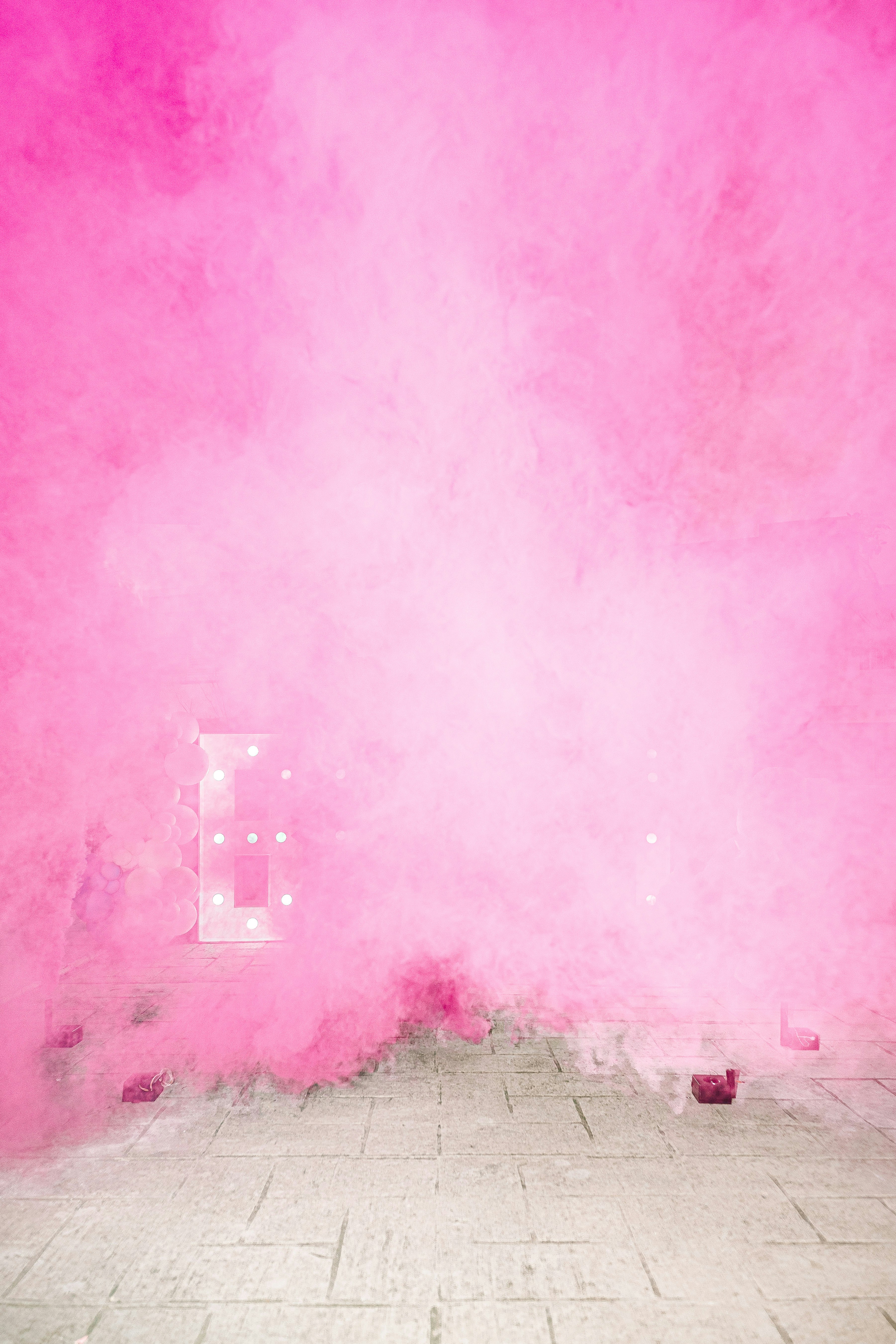 Pink Fog Over Quiet Plaza with Lighted Panels