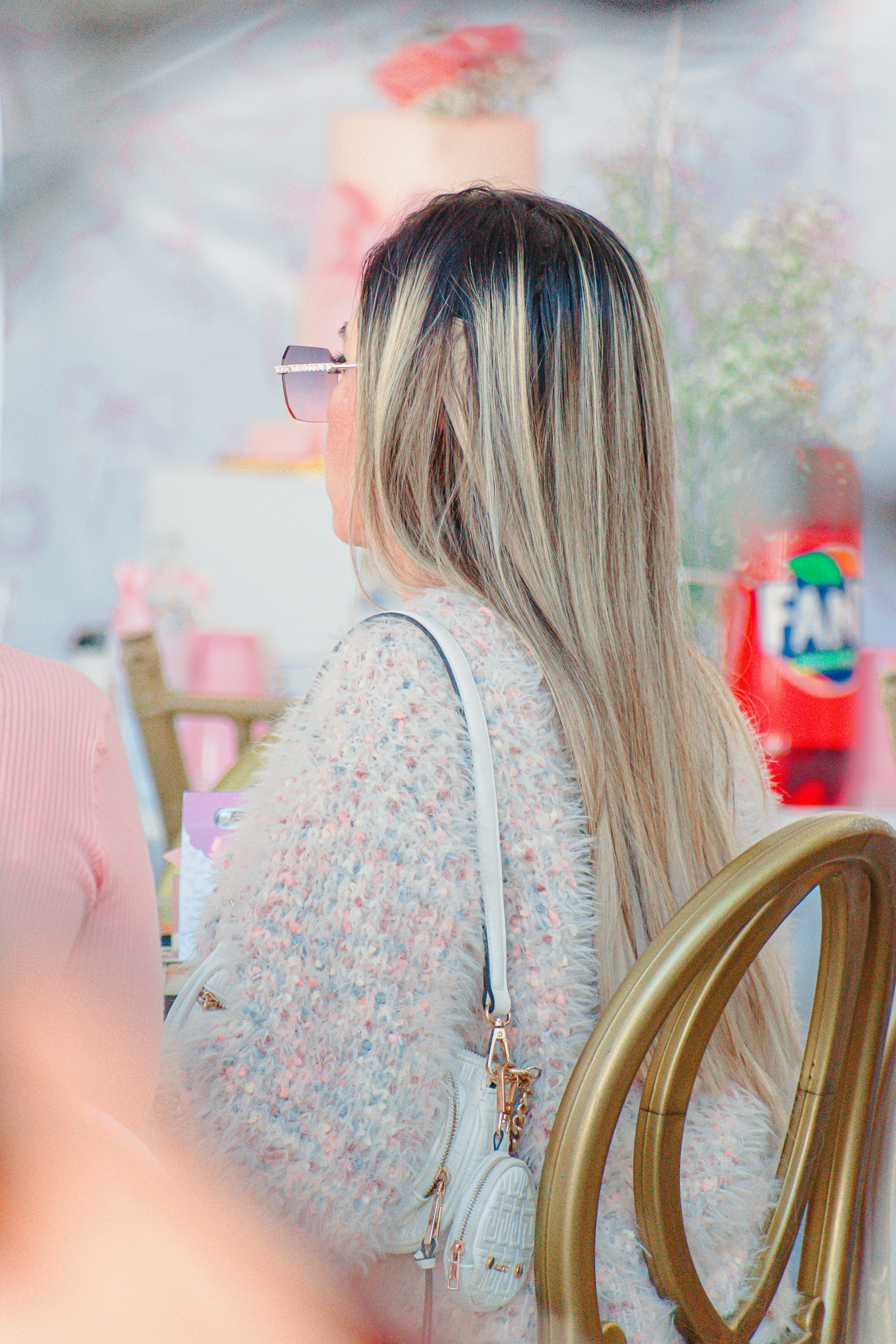 Side Portrait Through a Soft, Blurred Cafe Backdrop