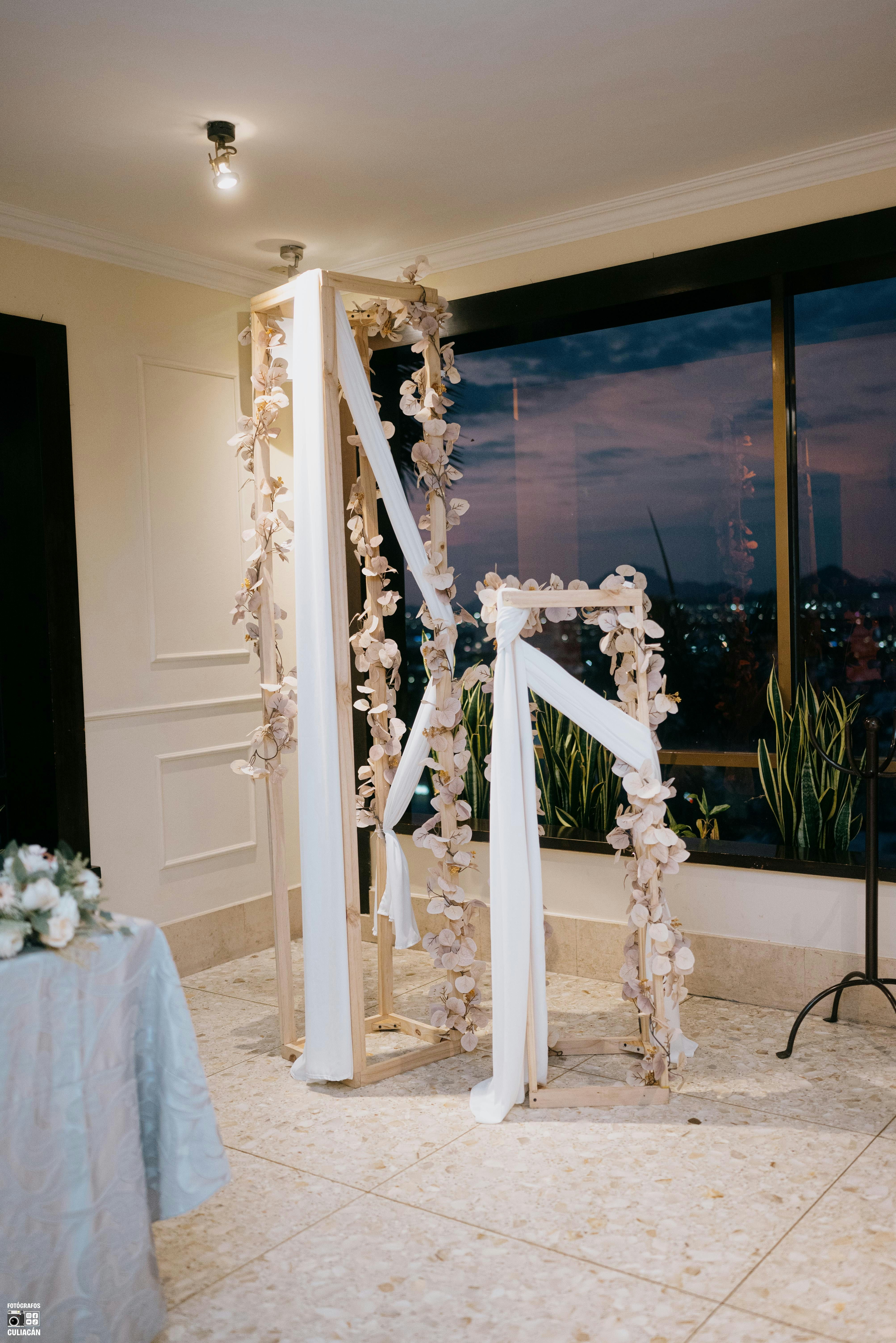 Floral Archway Station with Draped Silk in Evening Light