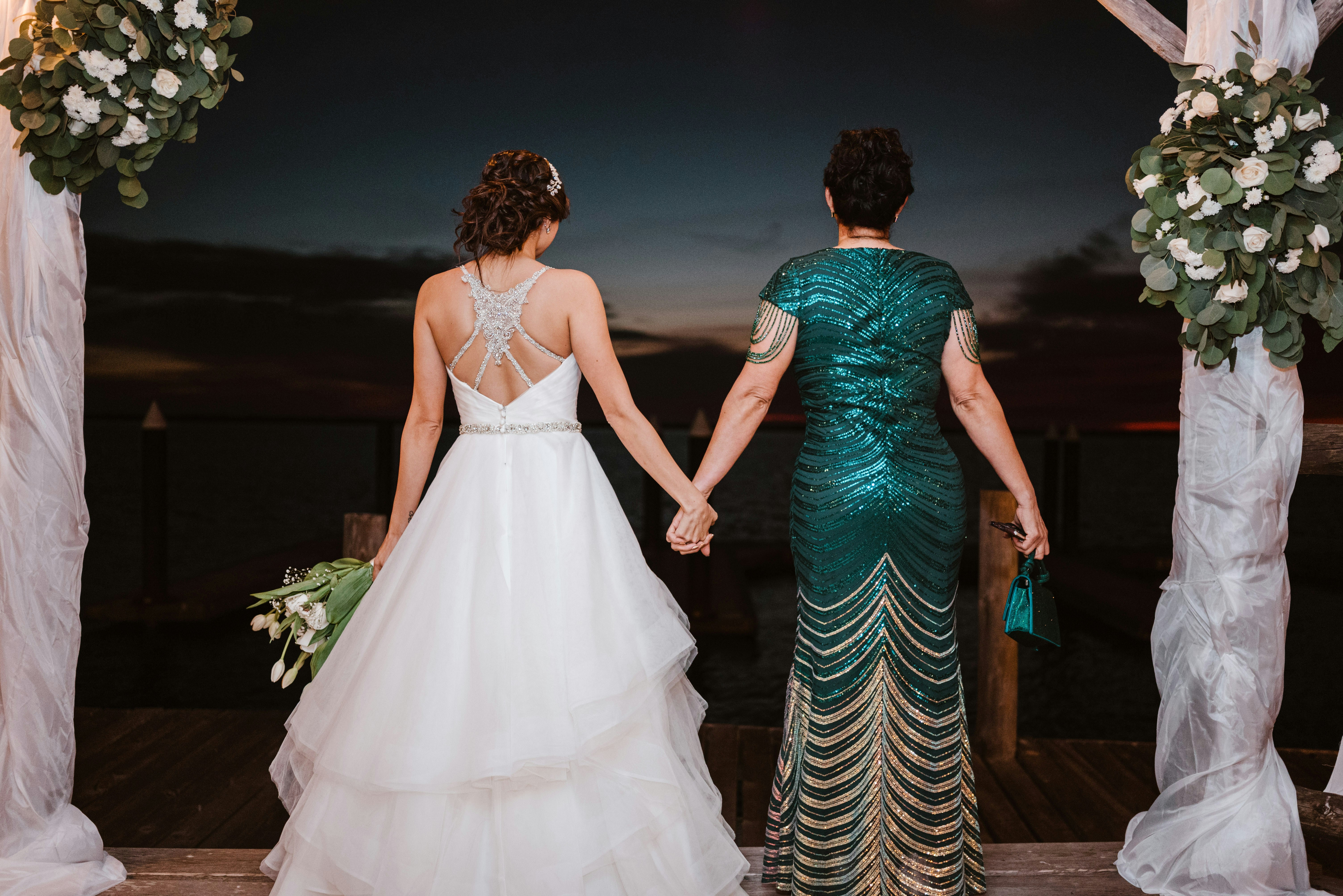 Holding Hands at Dusk: A Bride and Her Partner Step Into Forever