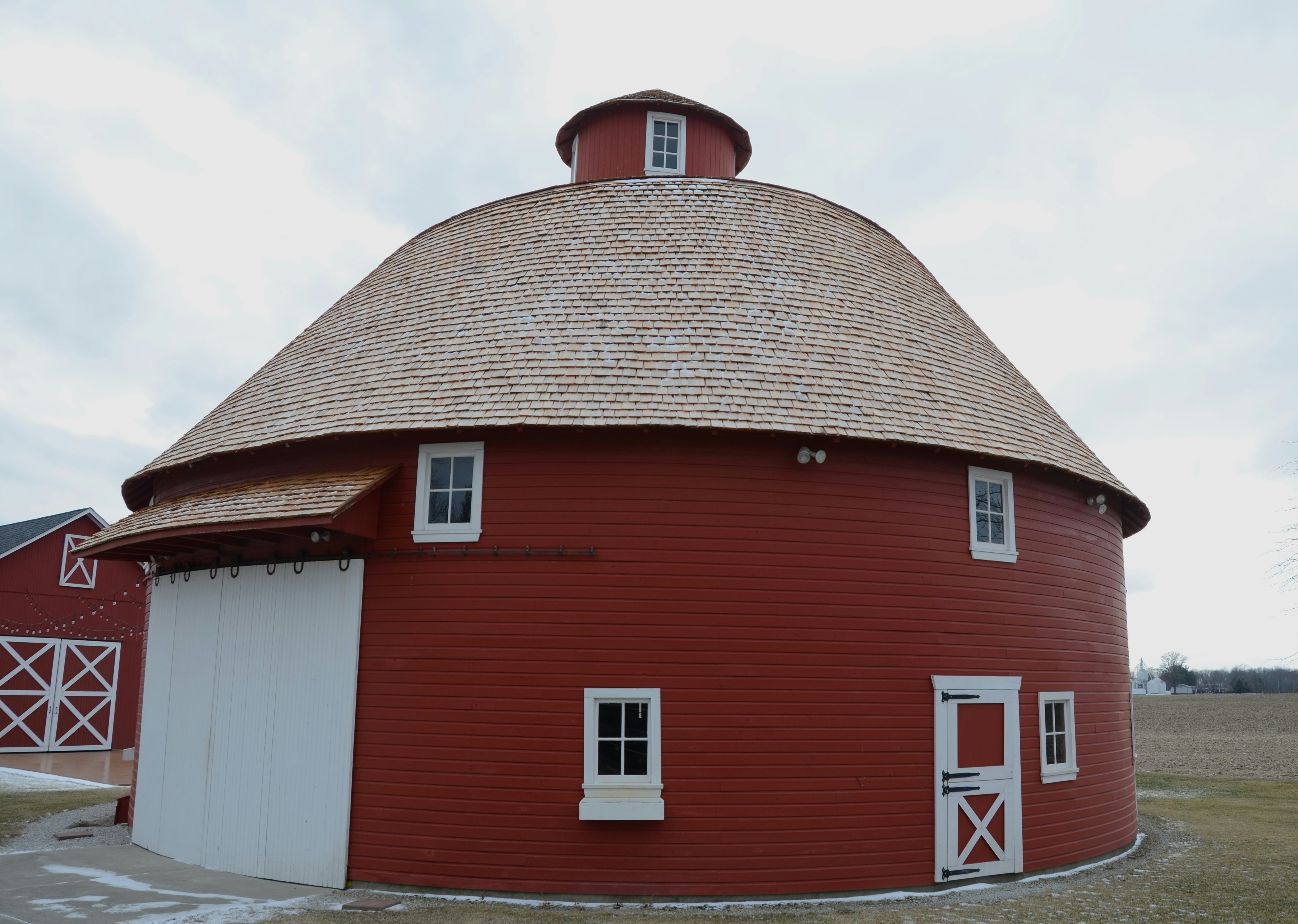 Red Round Barn Under a Gentle Sky