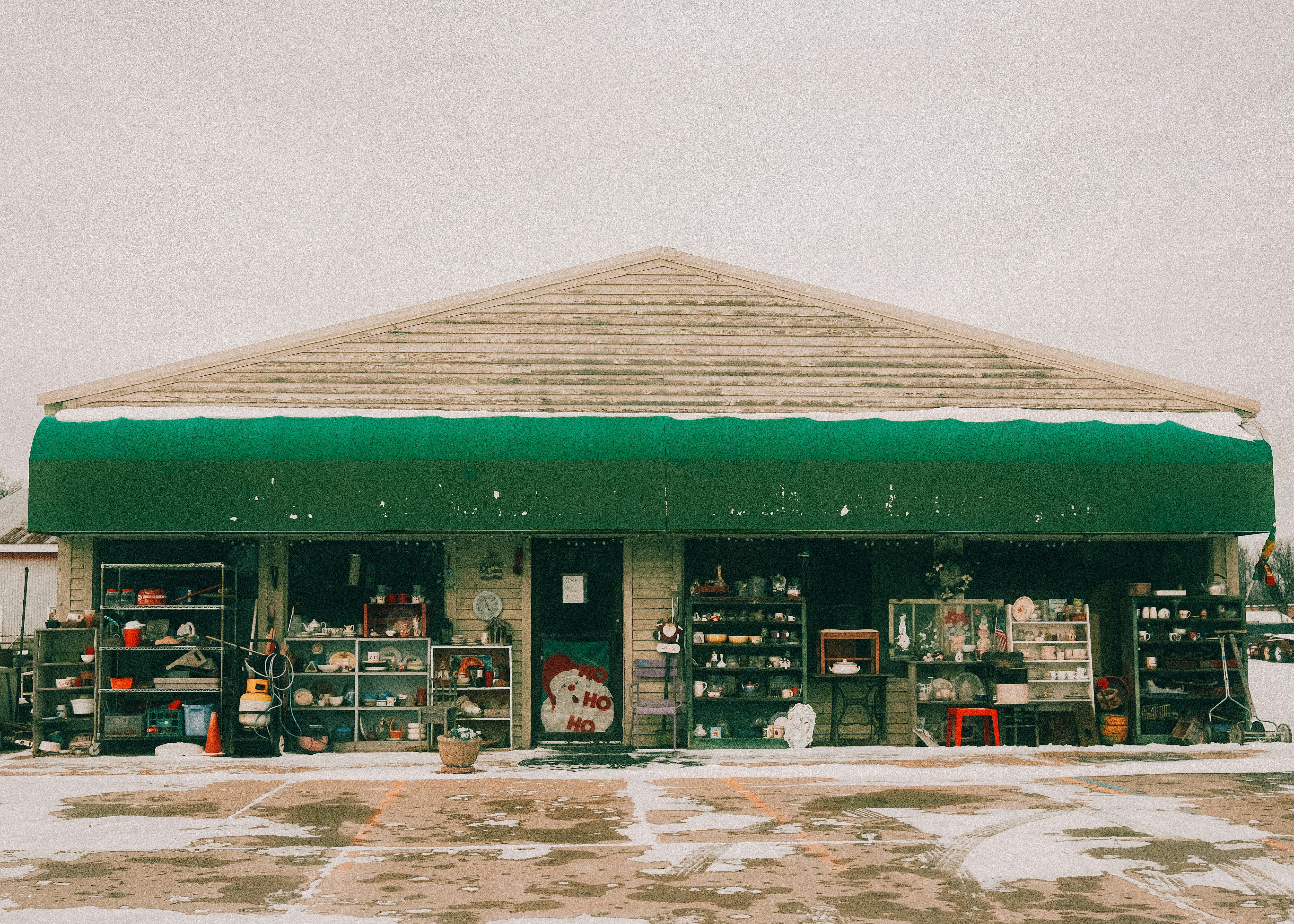 Green Canopy Over a Quiet Shopfront