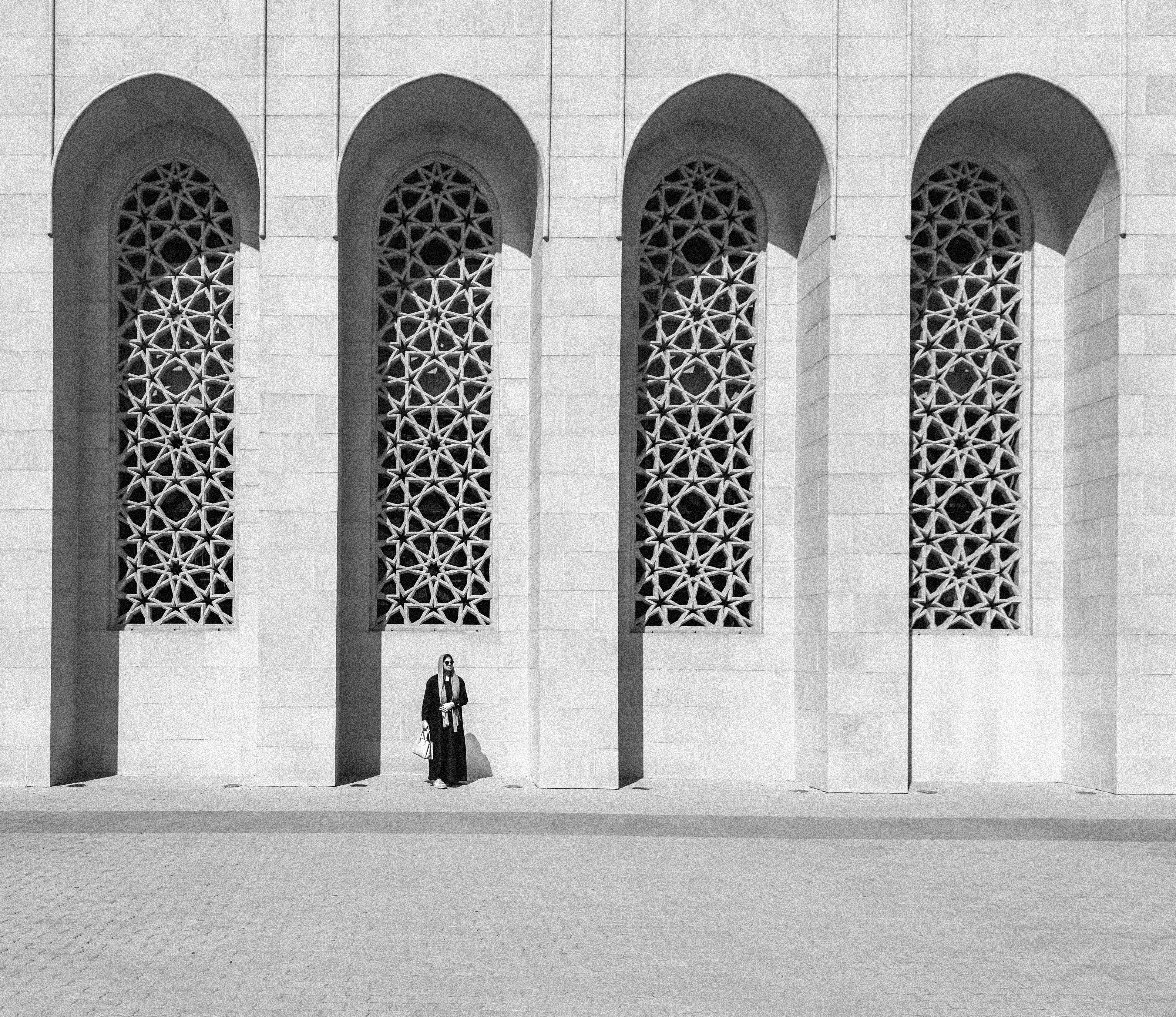 A person stands in an alcove of a building. photo – Free Architecture ...