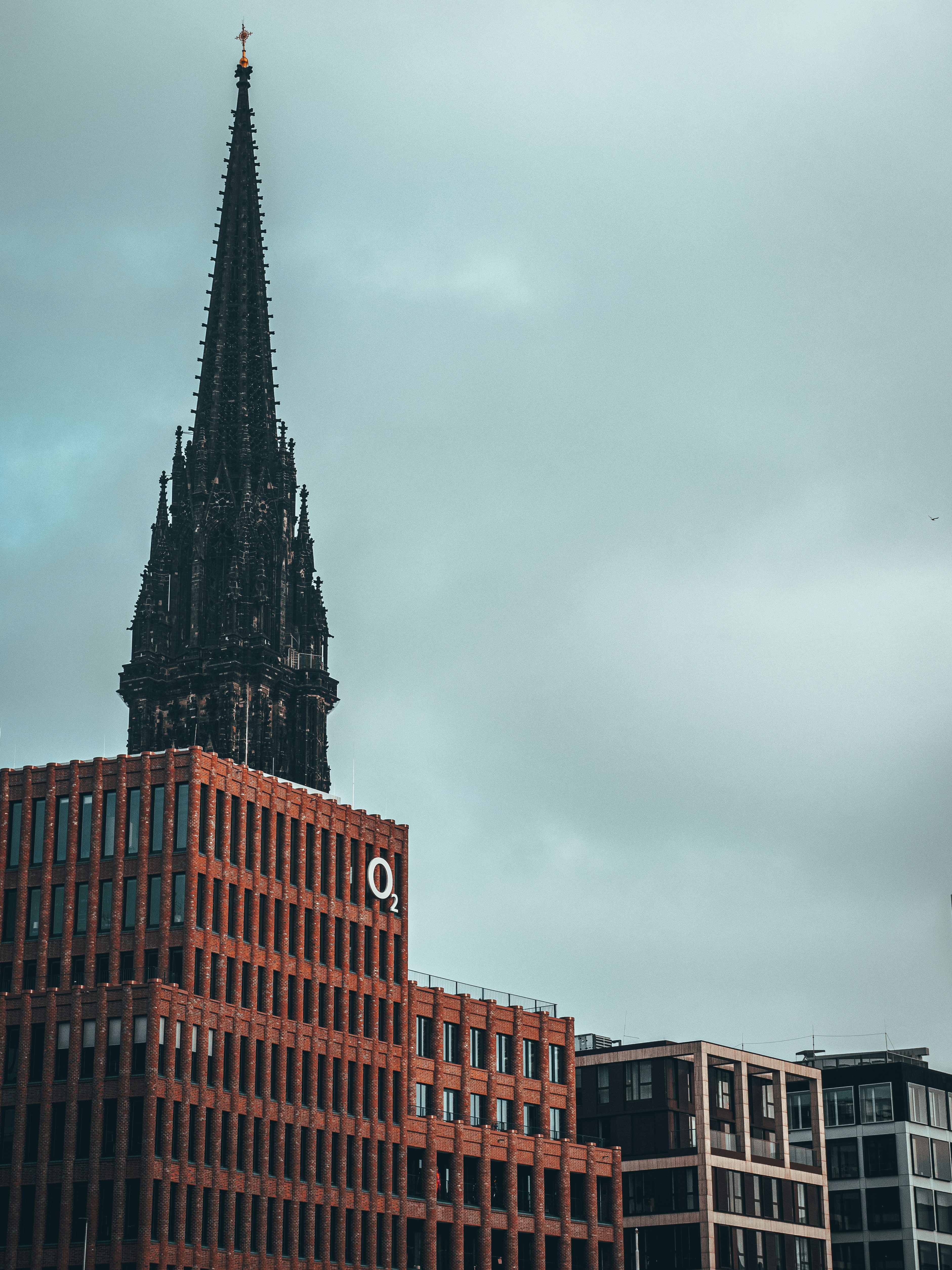 Gothic Spire Over Red Brick Block