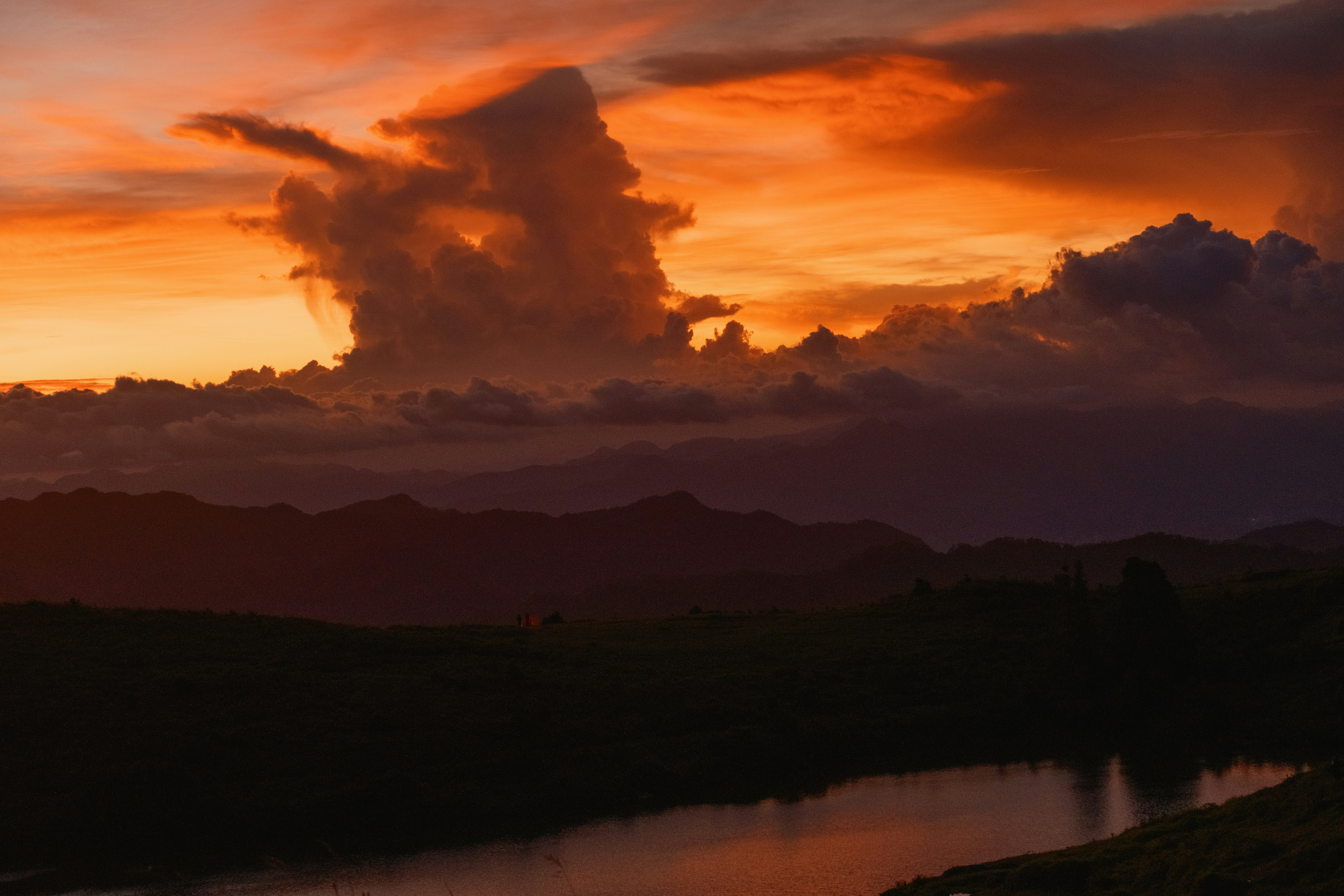 Crimson Dusk Over Quiet Floodplain