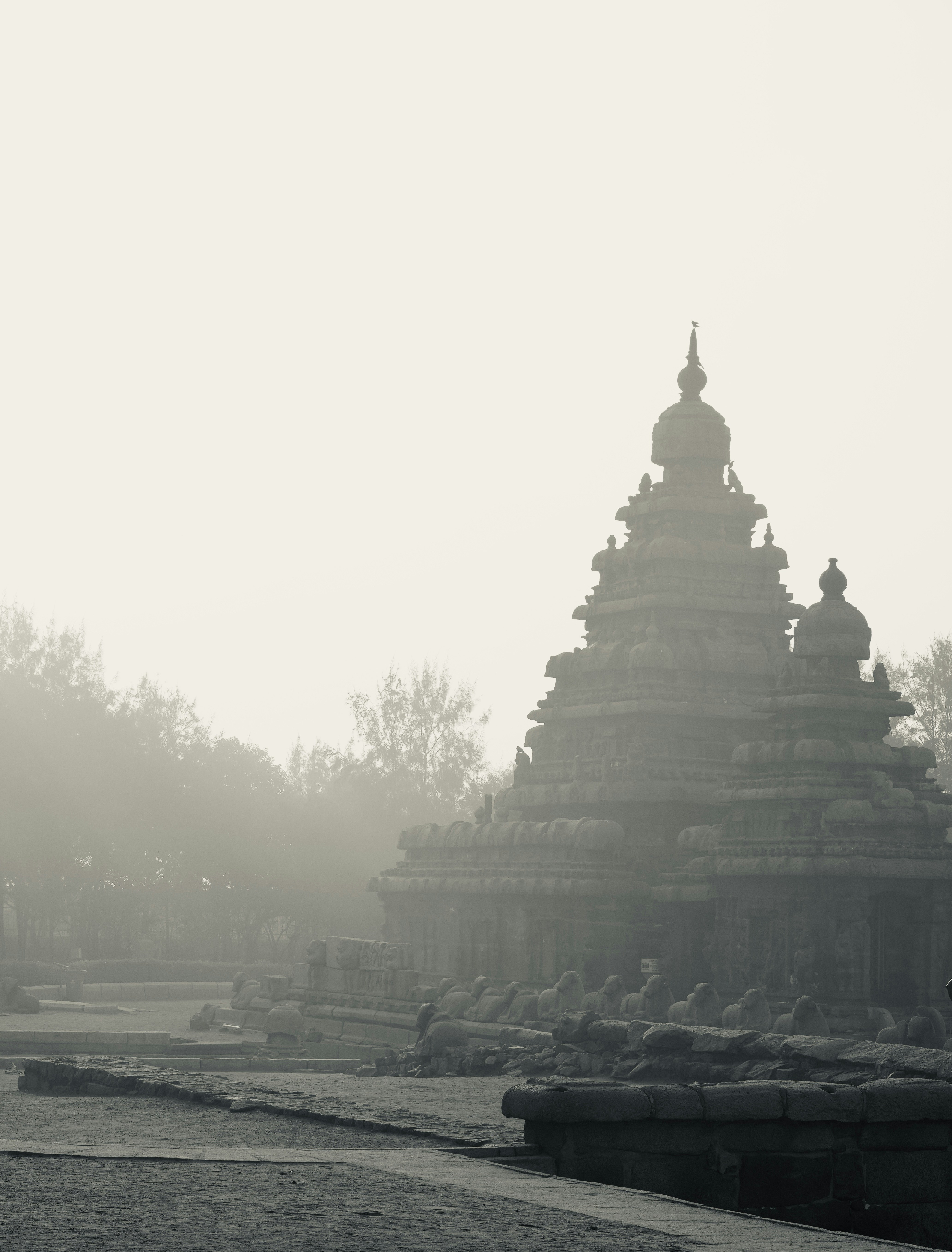 Silhouetted temple monument in early morning haze