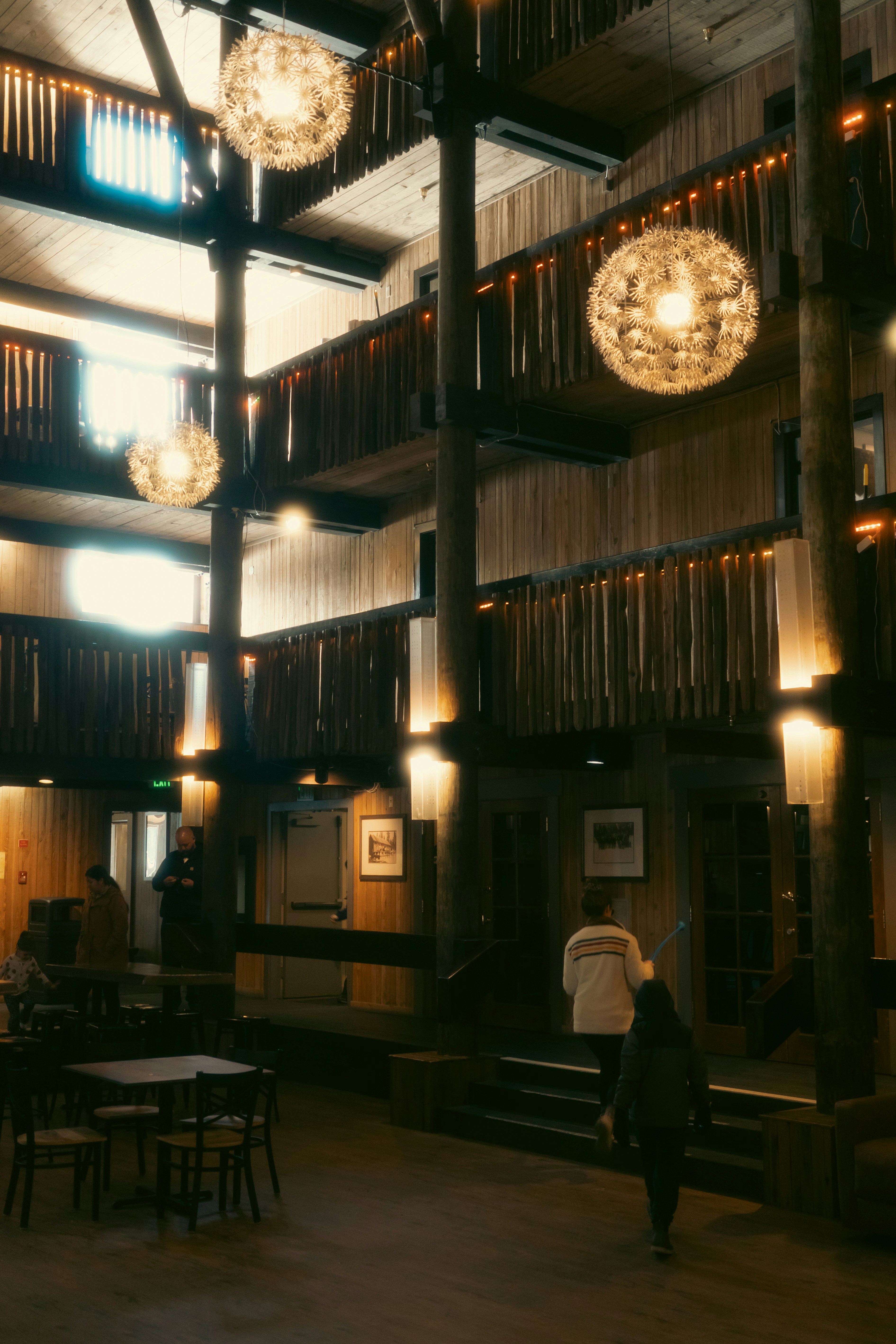 Pendant Orbs Over a Cozy Lodge Hall