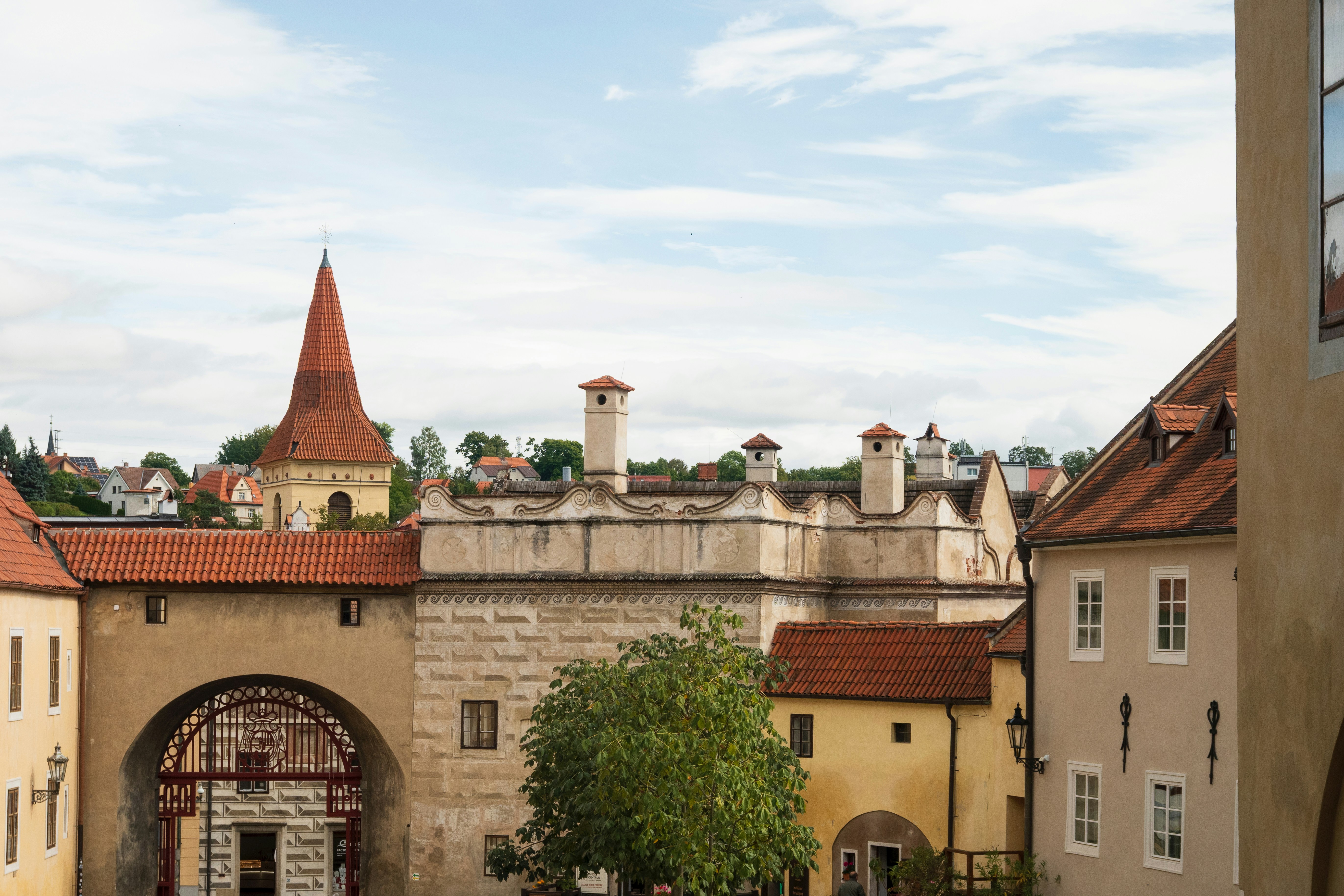 Towered Gateway Framed by Sunlit Town Walls